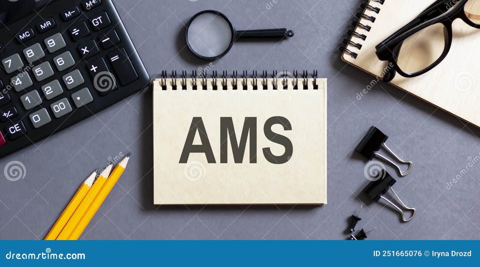 Word AMS on Notebook with Pencil on the Grey Background Stock Photo ...