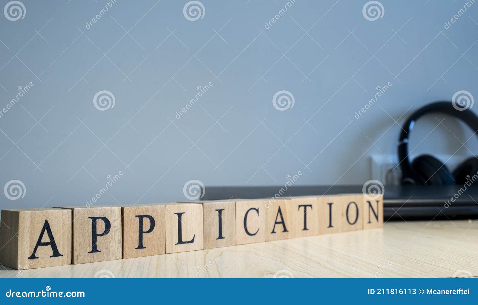 The Word Application is Written. Computer and Headset in the Background ...