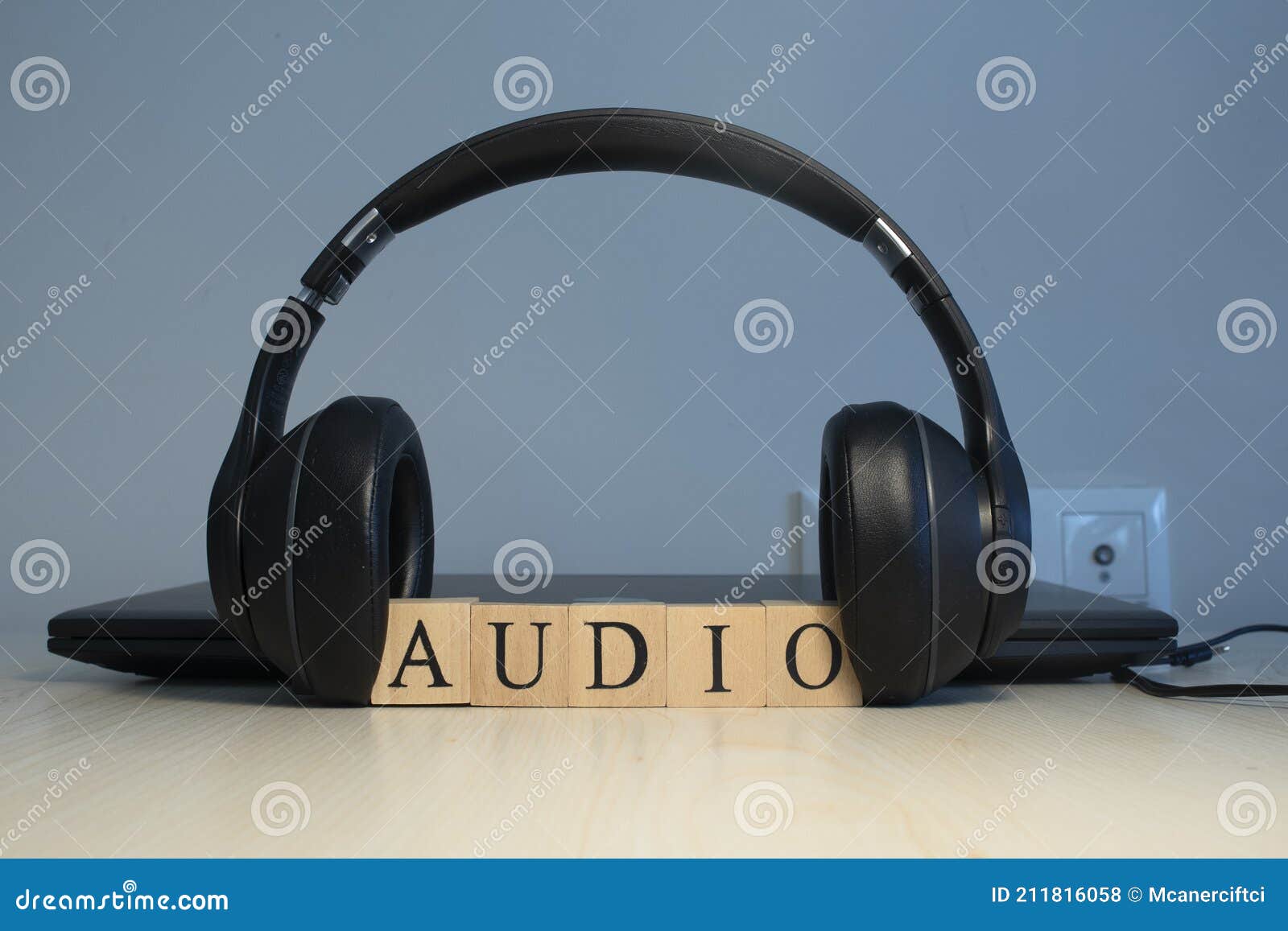 The Word Audio is Written. Computer and Headset in the Background Stock ...