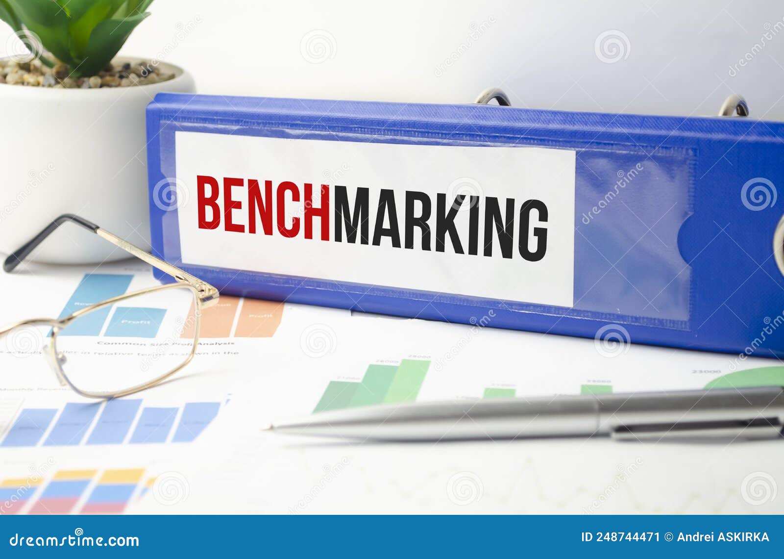 Word Benchmarking on Blue File Folder on Charts Stock Image - Image of ...
