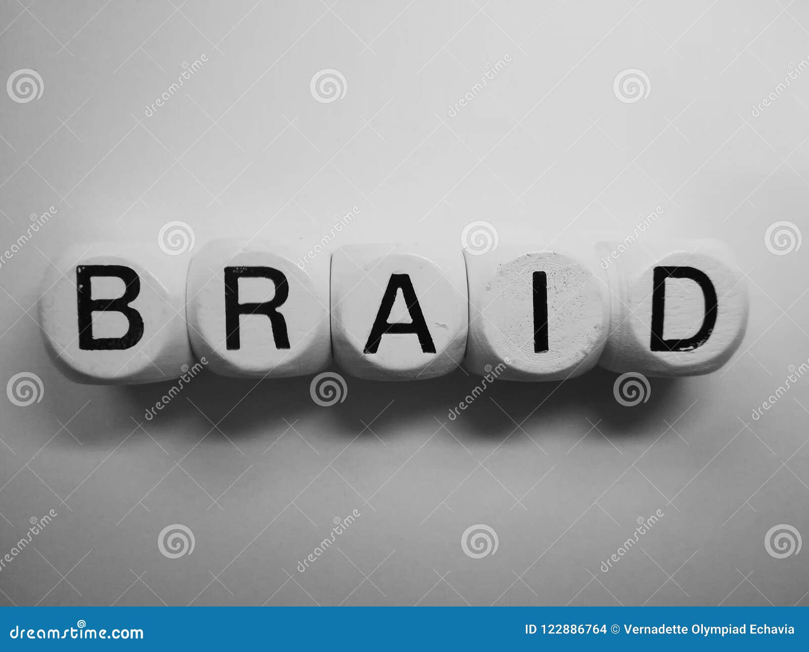 Word braid on wooden dice stock photo. Image of spelling - 122886764
