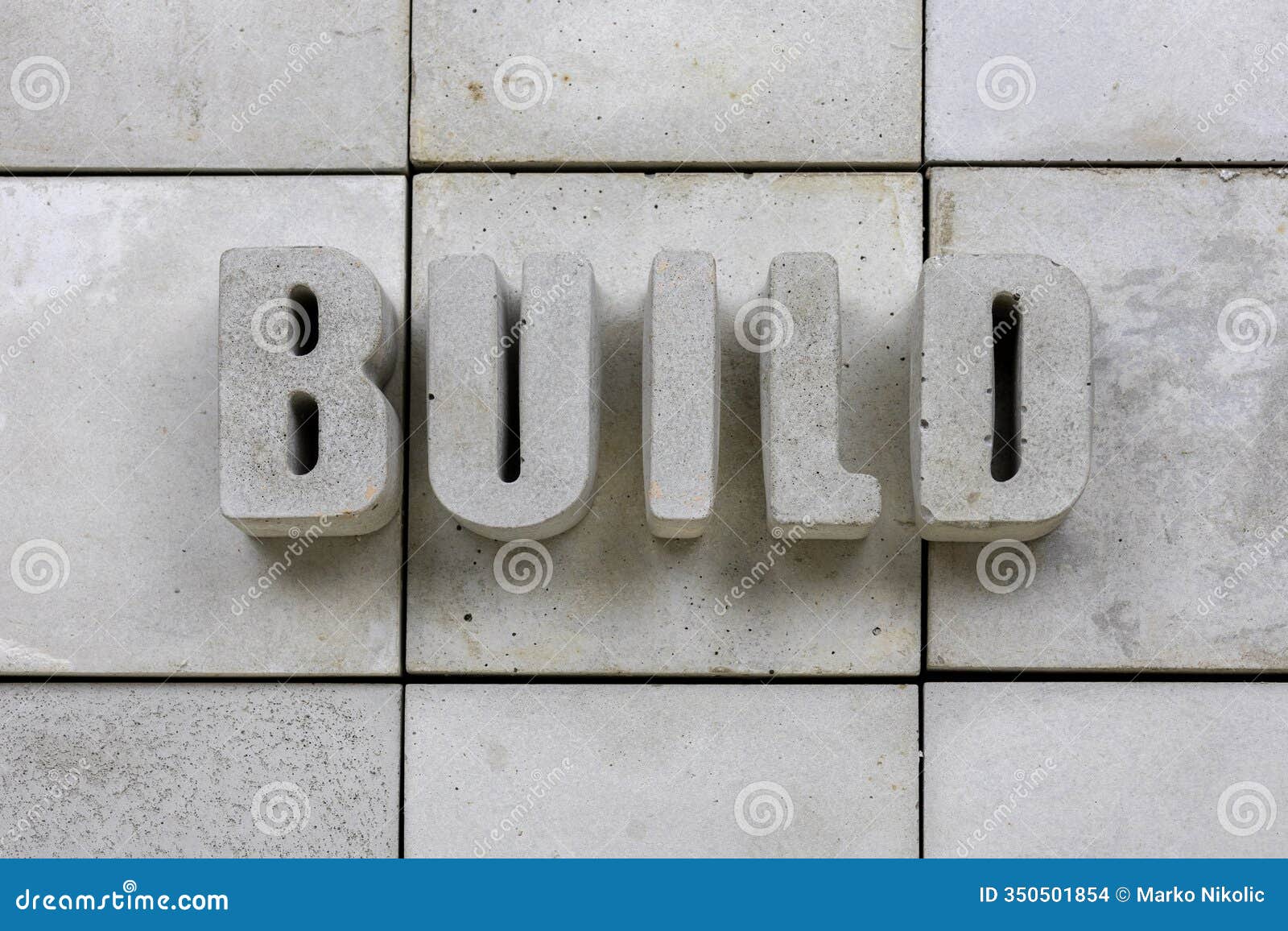 Word BUILD in Concrete Letters on Concrete Tiled Background Nice Copy ...
