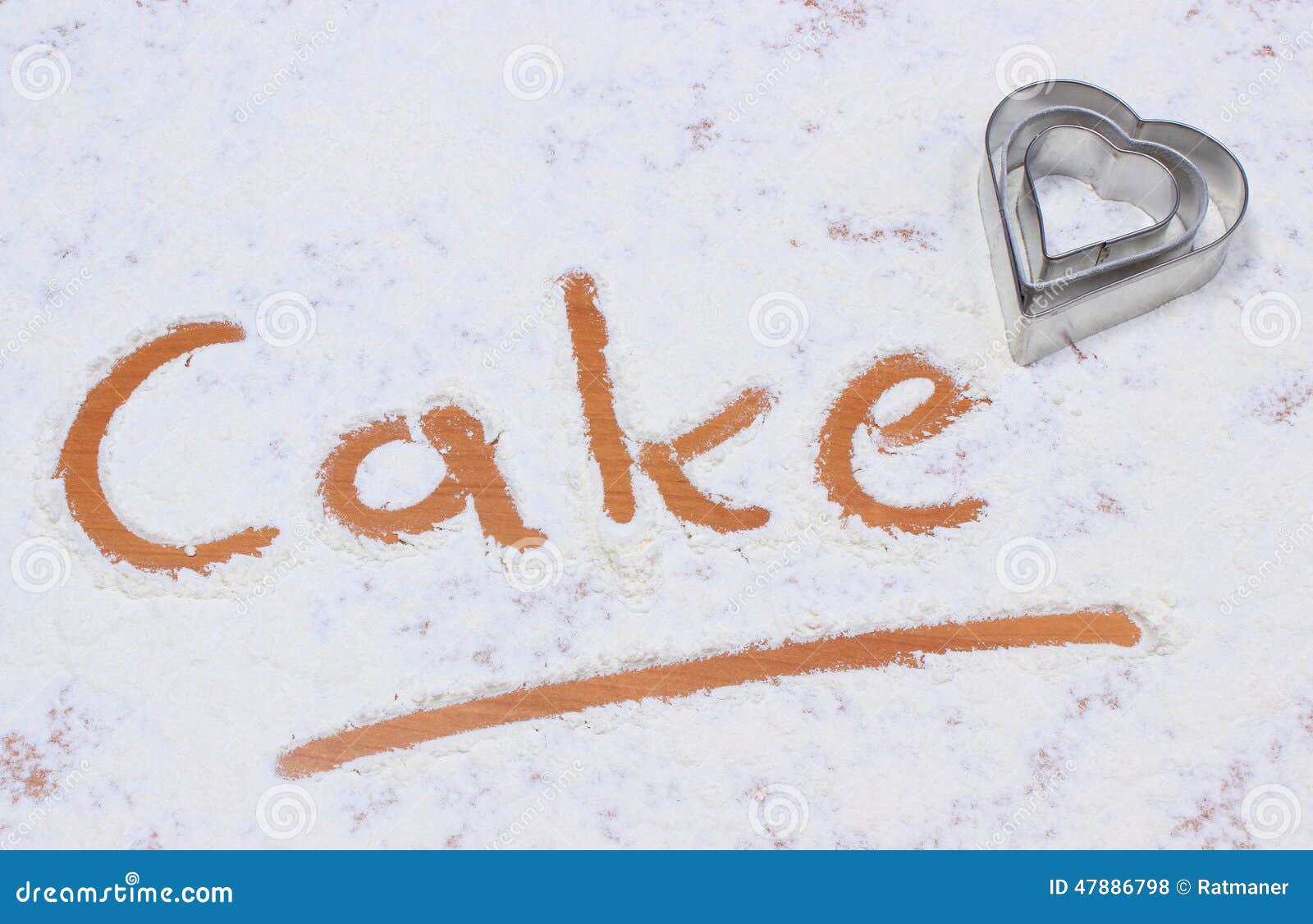 Word Cake Written in Flour and Cookie Cutters Stock Photo - Image of ...