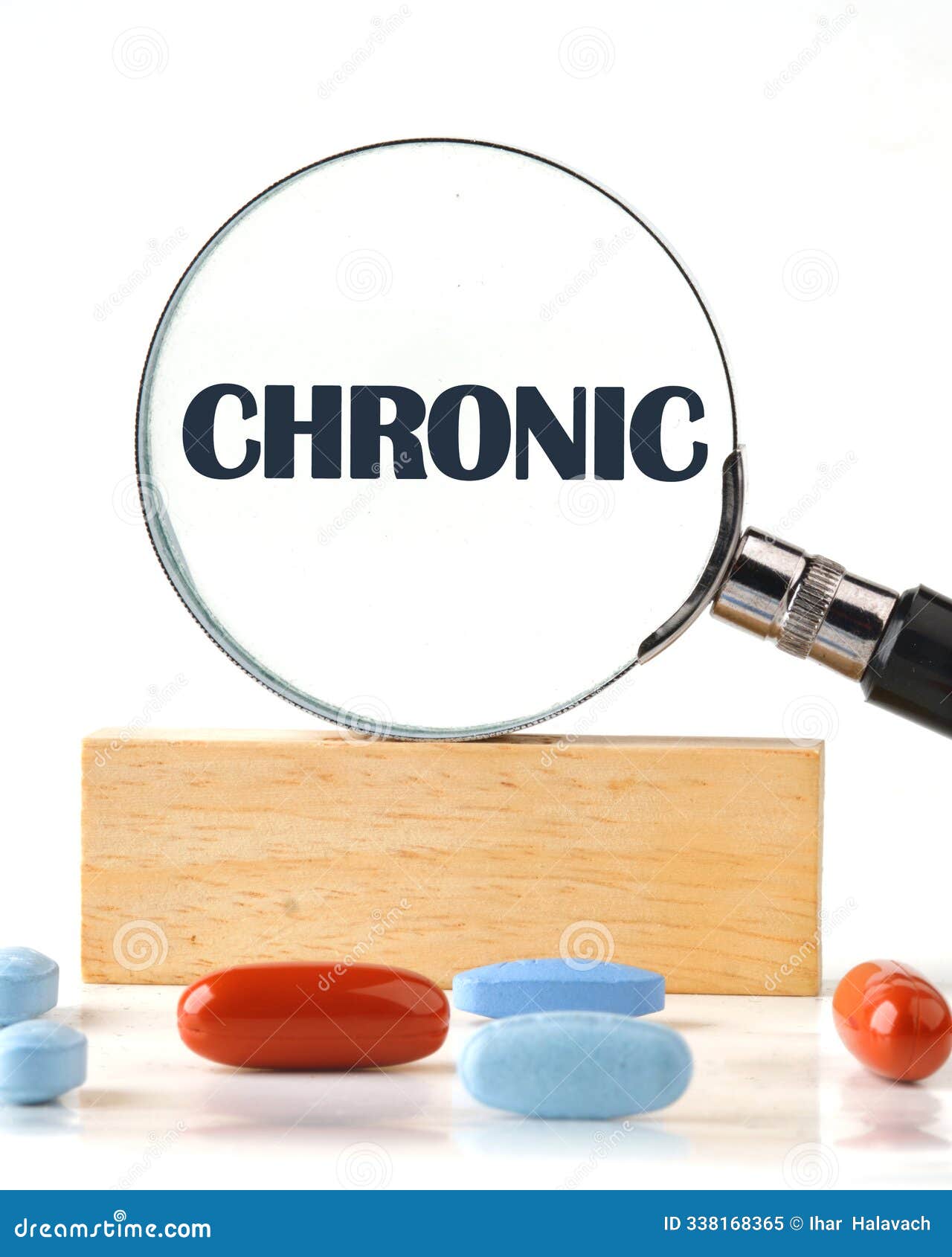The Word Chronic is Written Close-up through a Magnifying Glass. Front ...
