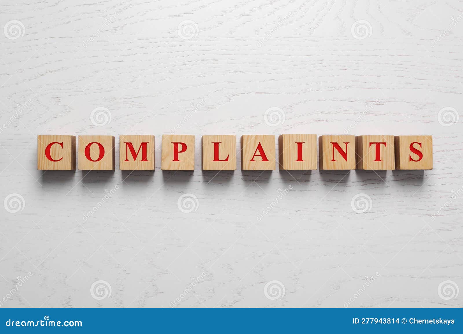 Word Complaints Made of Cubes on White Wooden Table, Top View Stock ...
