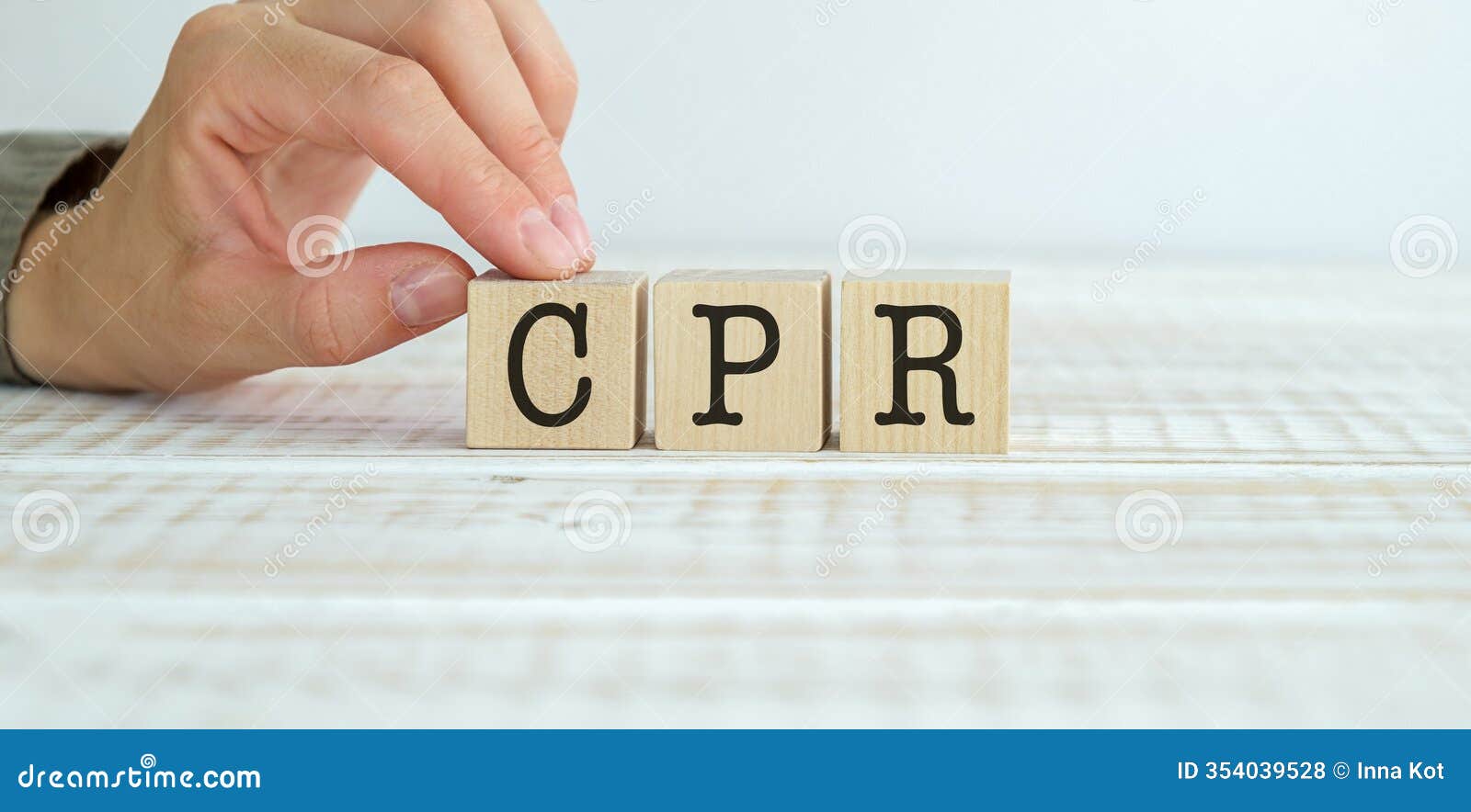 The Word CPR Which is Made from Wooden Cubes in Hands on Wooden ...