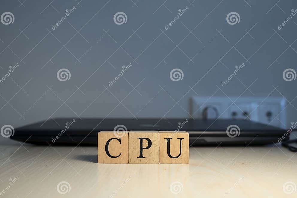 The Word CPU is Written. Computer and Headset in the Background ...
