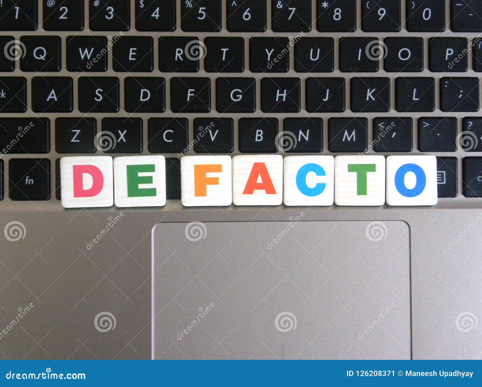 Words DE FACTO RIGHTS Composed Of Wooden Letters. Small Paper House In ...