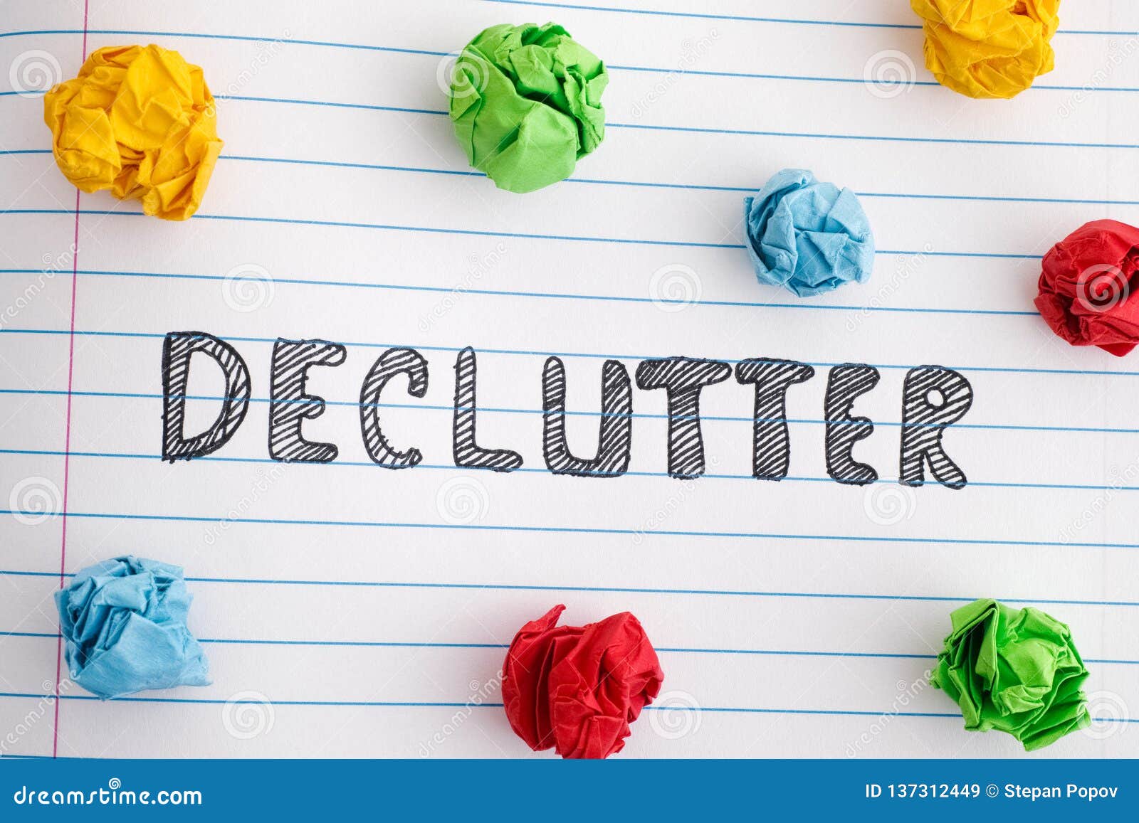 The Word Declutter on Notebook Sheet with Colorful Crumpled Paper Balls ...
