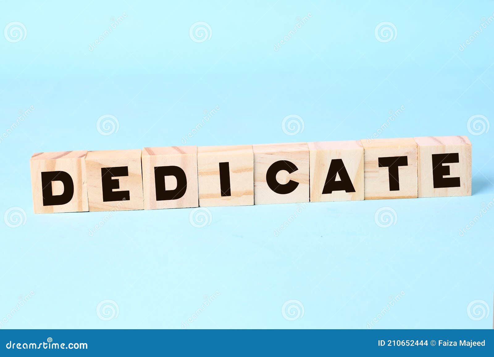 Word Dedicate on a Row of Wooden Blocks. Devotion Dedication Love ... Word Dedicate on a Row of Wooden Blocks. Devotion Dedication Love ...