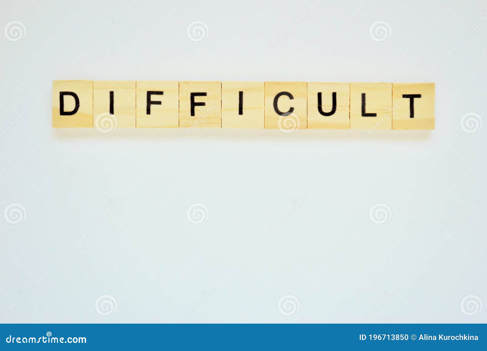 Word Difficult. Top View of Wooden Blocks with Letters on White Surface ...