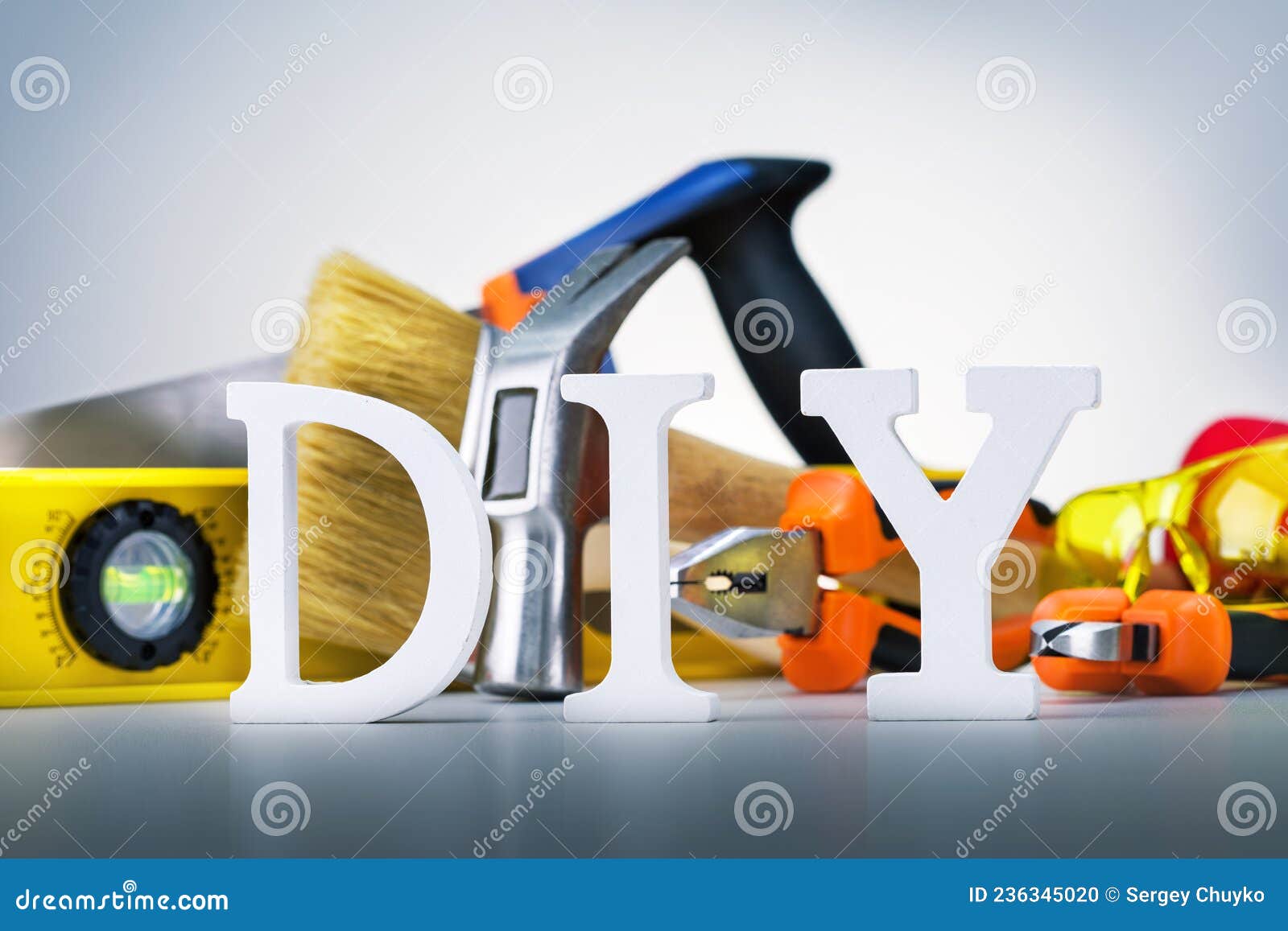 Word DIY and Different Tools on Grey Background Stock Photo - Image of ...
