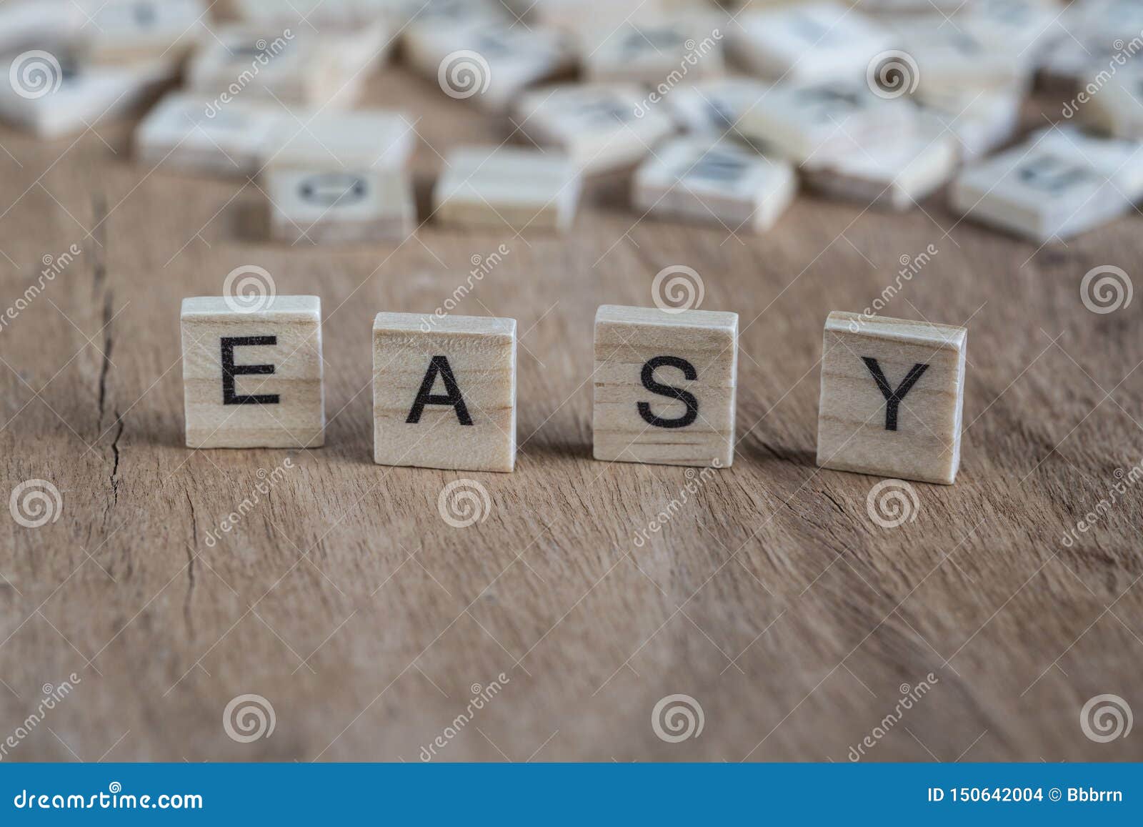 The Word Easy Written with Cube Letters on Wood Background Stock Photo ...