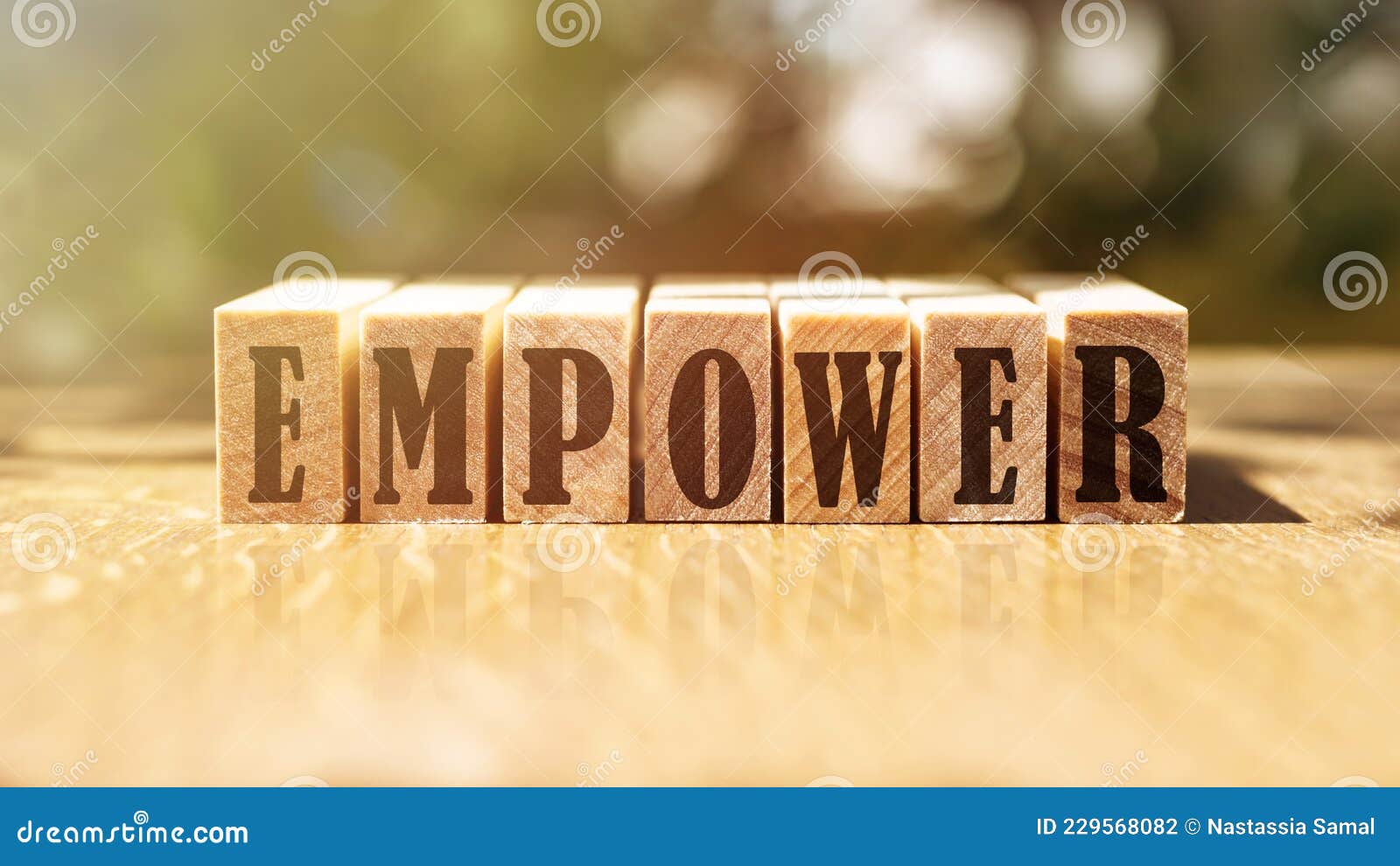 Word EMPOWER Made with Building Wooden Blocks on Table in Sunlight ...