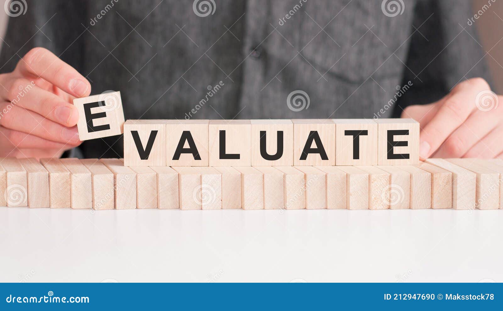 The Word of EVALUATE on Building Blocks Concept Stock Photo - Image of ...
