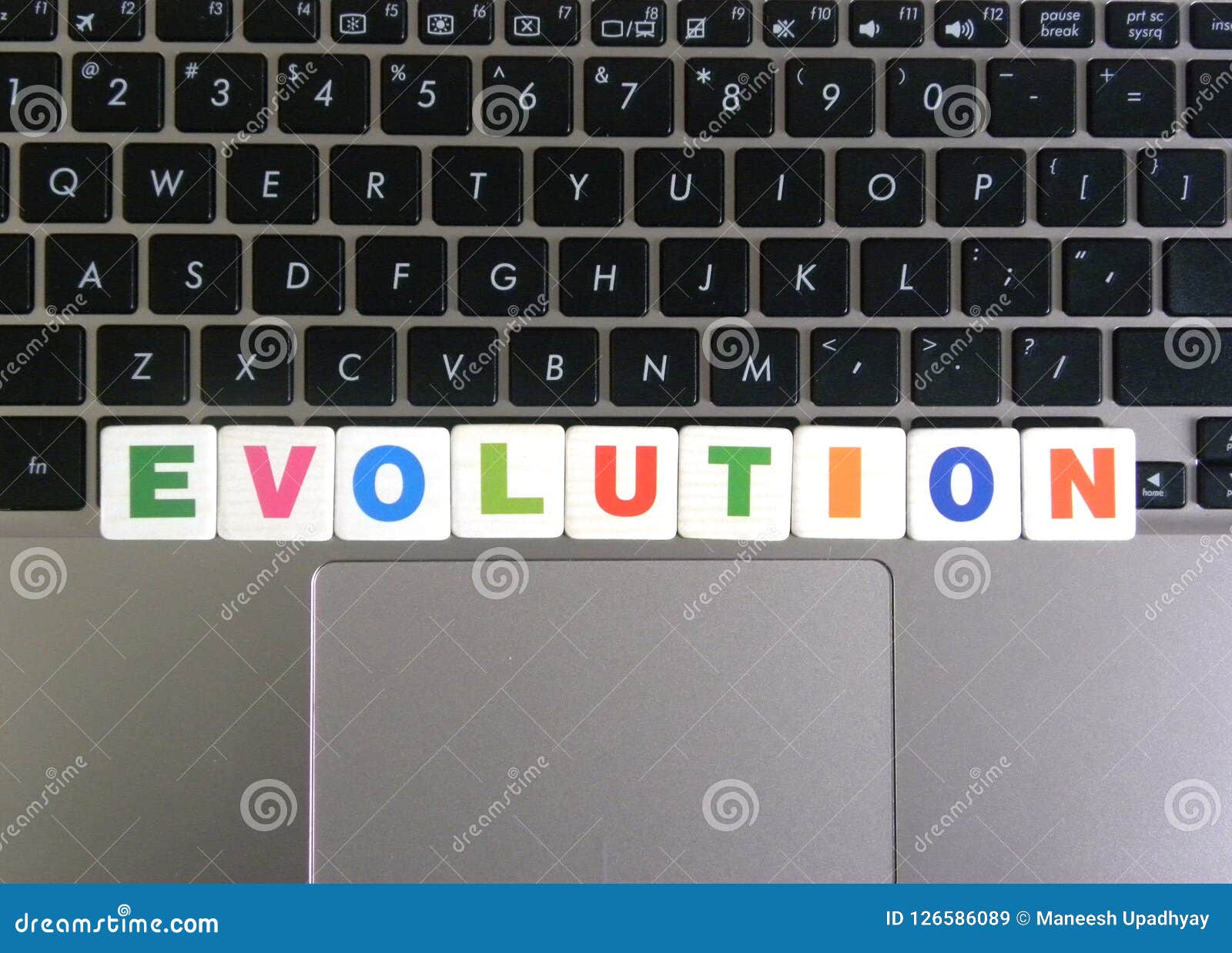 Word Evolution on Keyboard Background Stock Image - Image of device ...