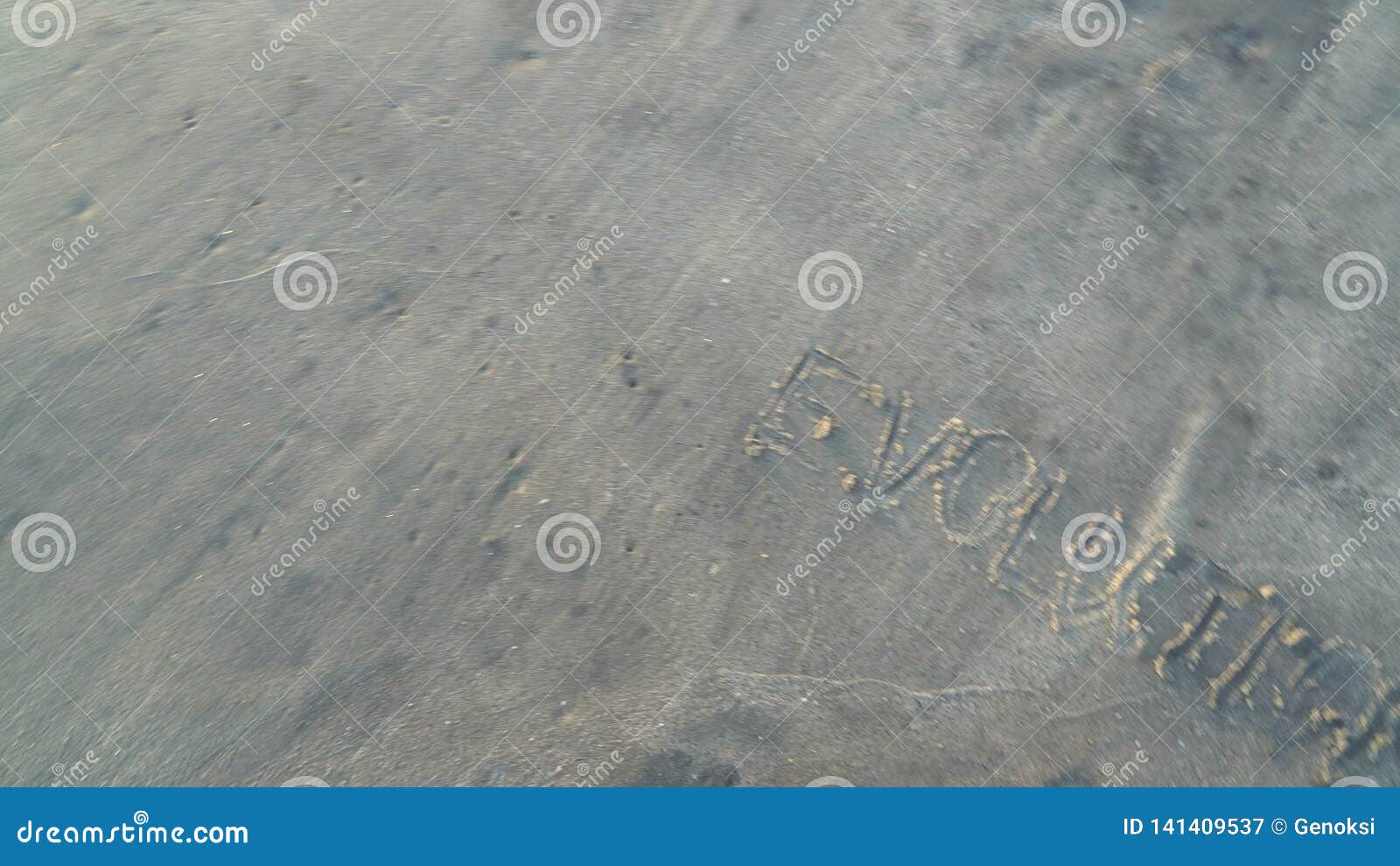 Word Evolution Writtern on Beach Sand is Being Washed Off by Ocean ...