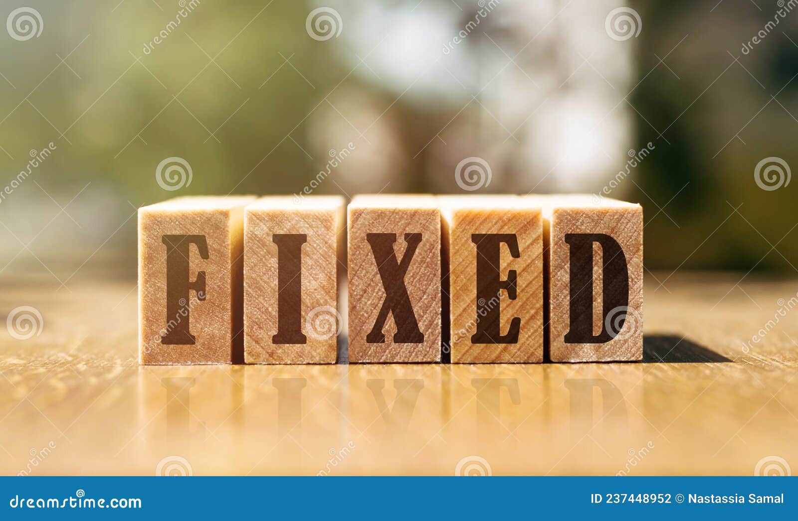 Word FIXED Made with Building Wooden Blocks on Table in Sunlight Stock ...
