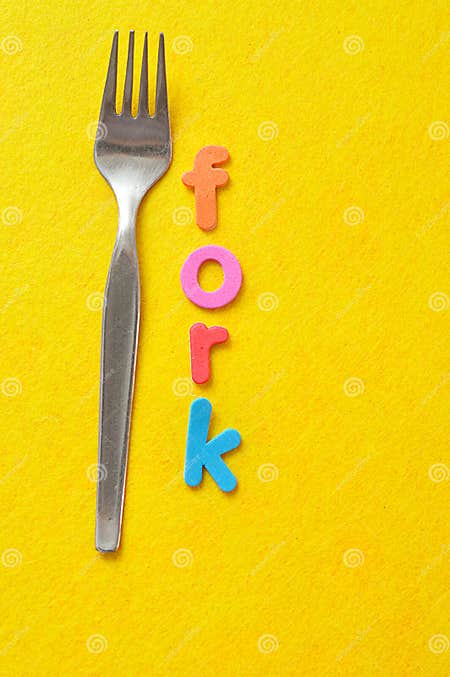 The Word Fork Displayed with a Fork Stock Photo - Image of equipment ...