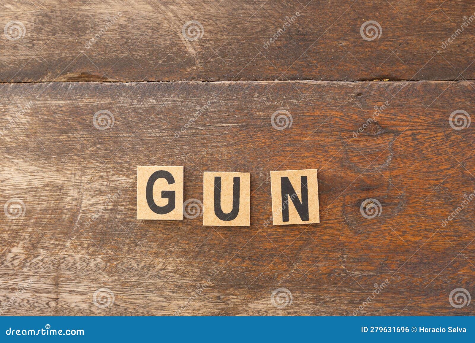 The Word Gun Formed with Wooden Blocks on a Rustic Background Stock ...