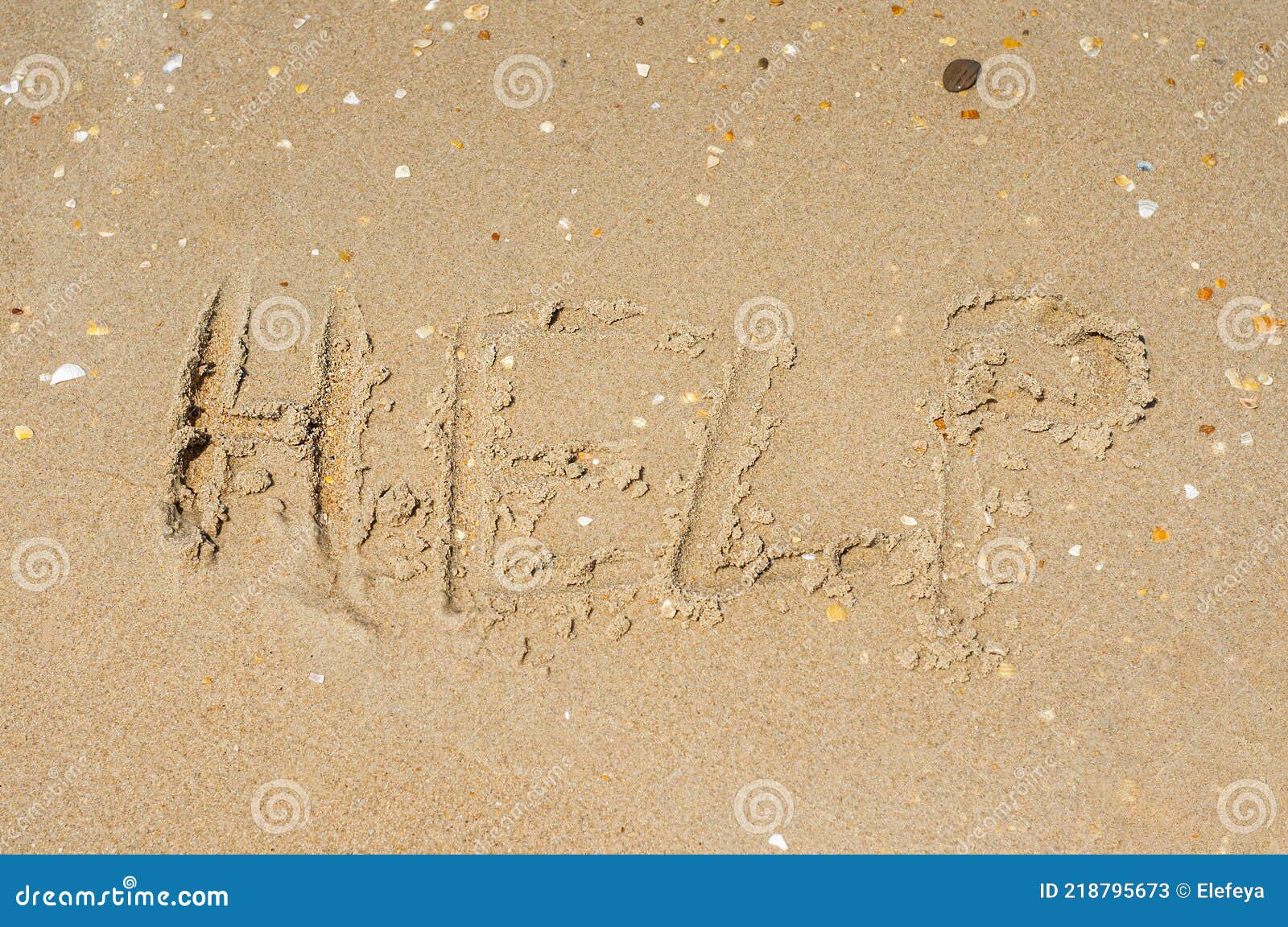 The Word `help` Written in the Sand in Capital Letters. the Concept of ...
