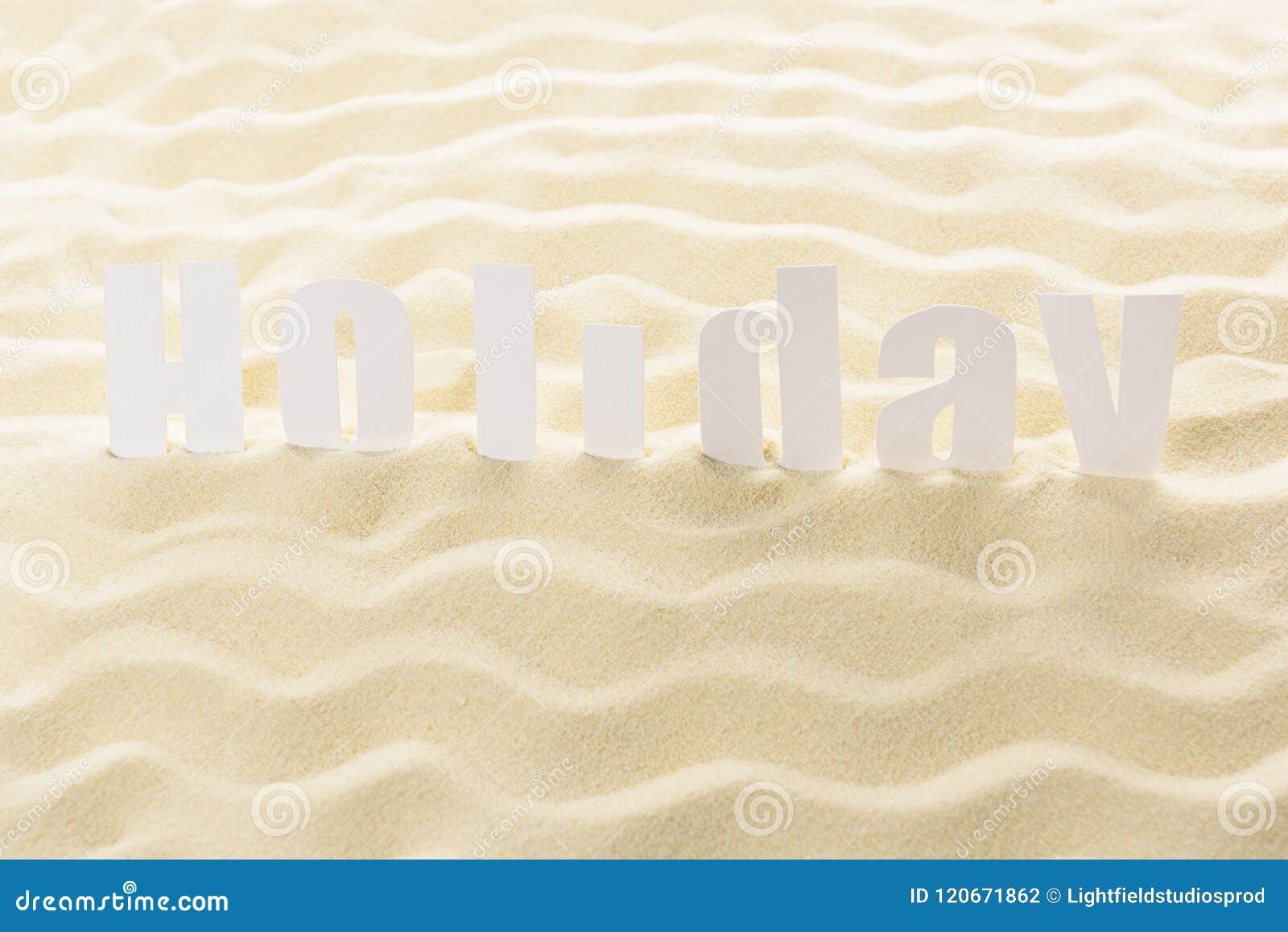 Word Holiday on sandy stock photo. Image of holiday - 120671862
