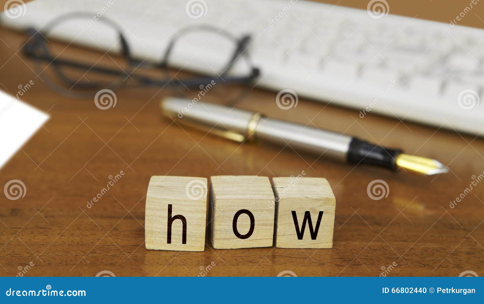 The word how on wood stamp stock photo. Image of question - 66802440