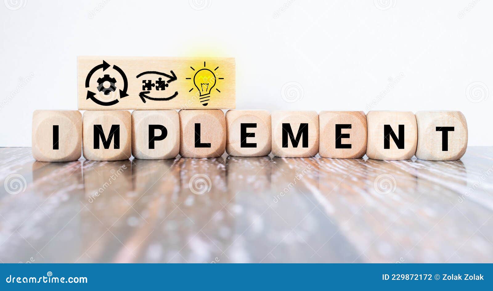 Word Implement. Top View of Wooden Blocks with Letters on White Surface ...
