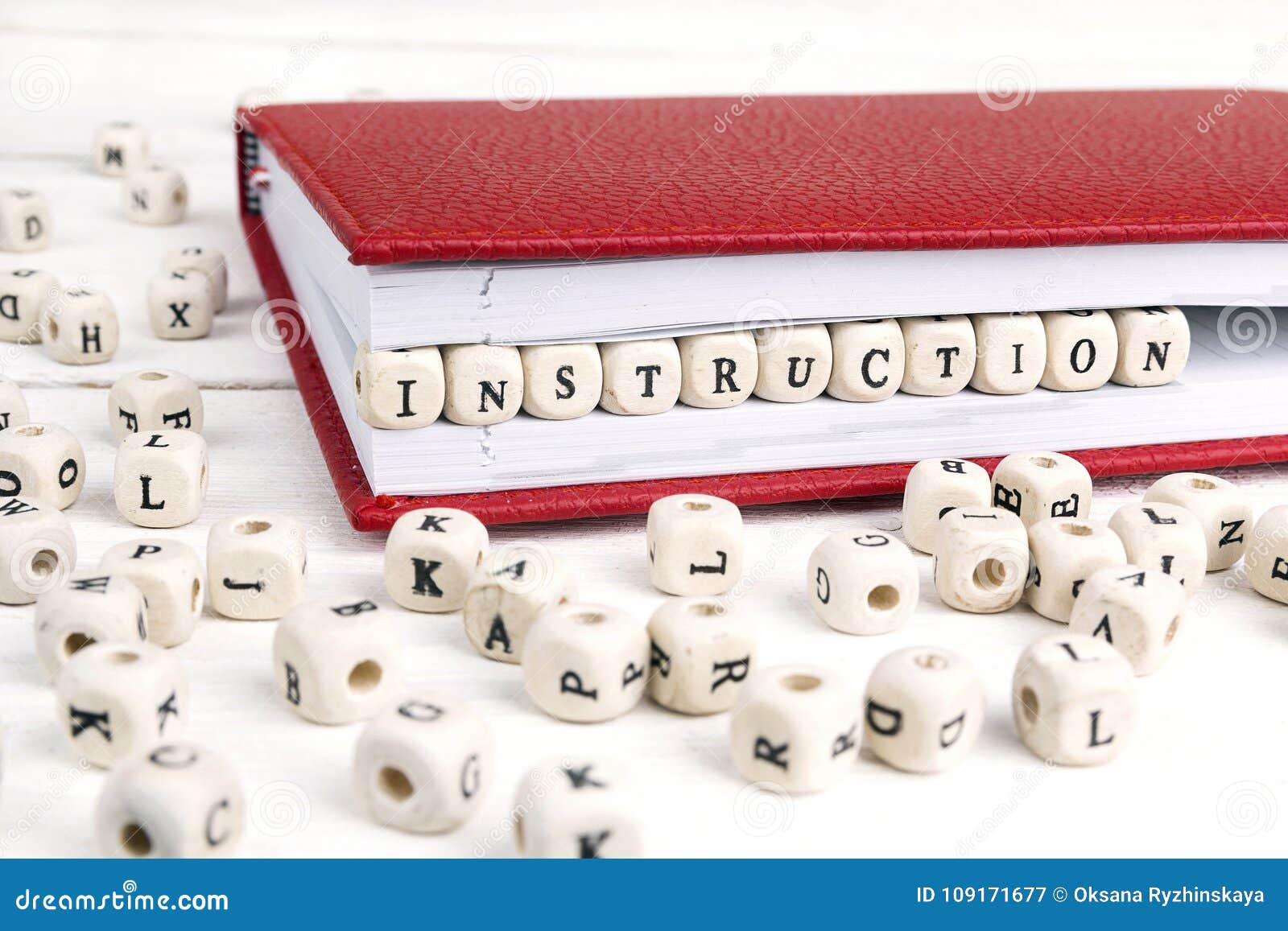 Word Instruction Written in Wooden Blocks in Red Notebook on White ...