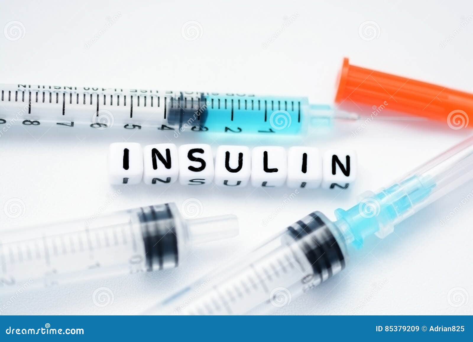 The Word Insulin Spelled with Plastic Letter Beads Next To a Syringe ...
