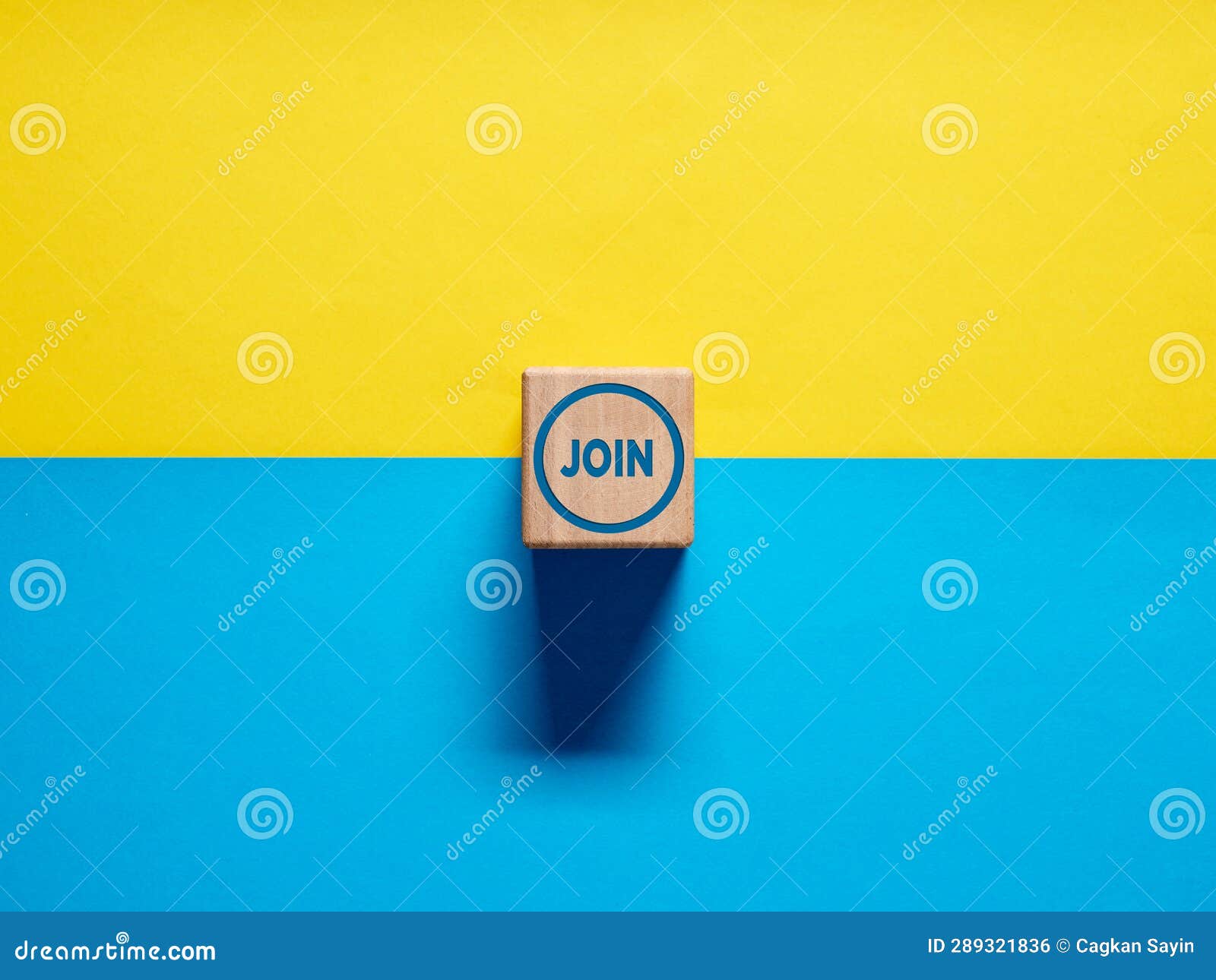The Word Join on Wooden Cube Push Button on Blue and Yellow Background ...