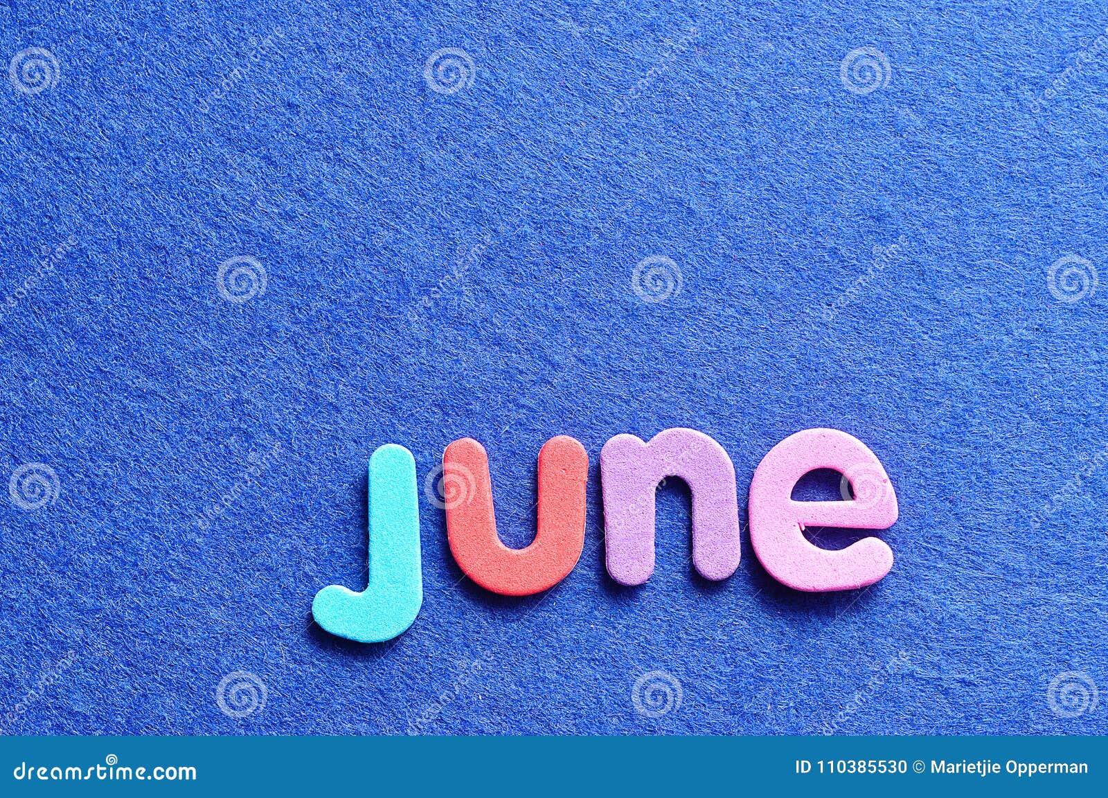 June on a blue background stock photo. Image of blue - 110385530