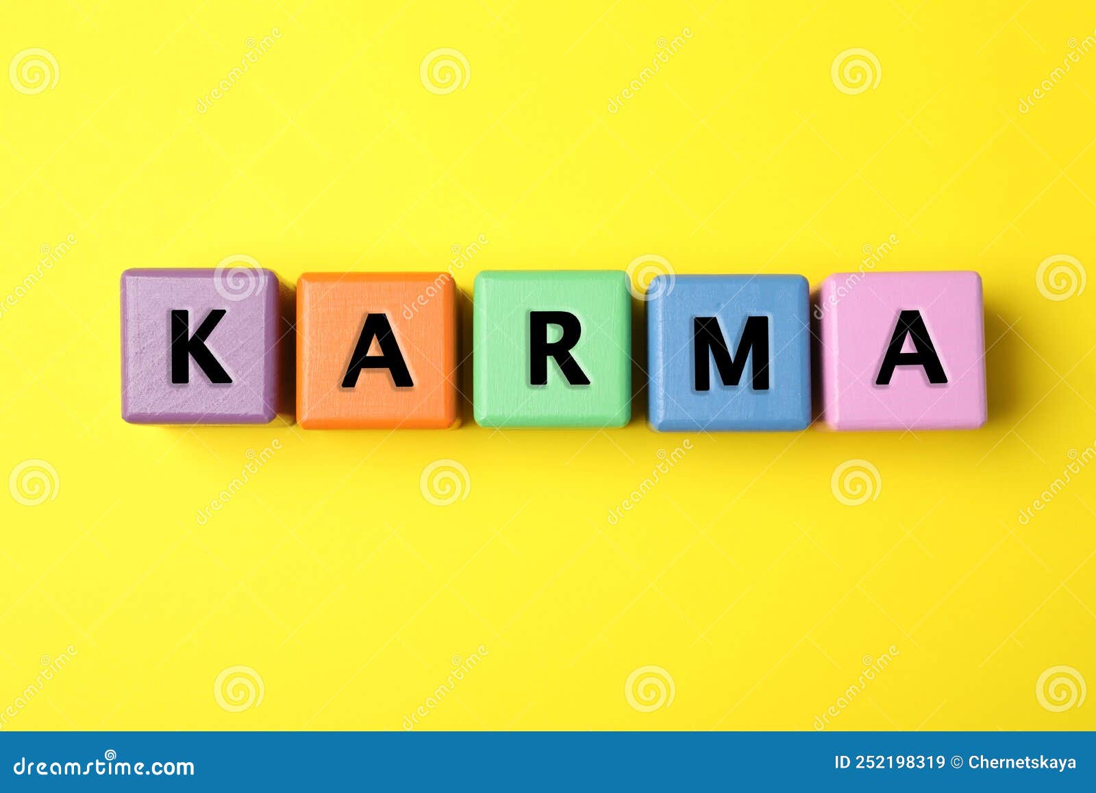 Word Karma Made of Colorful Cubes with Letters on Yellow Background ...