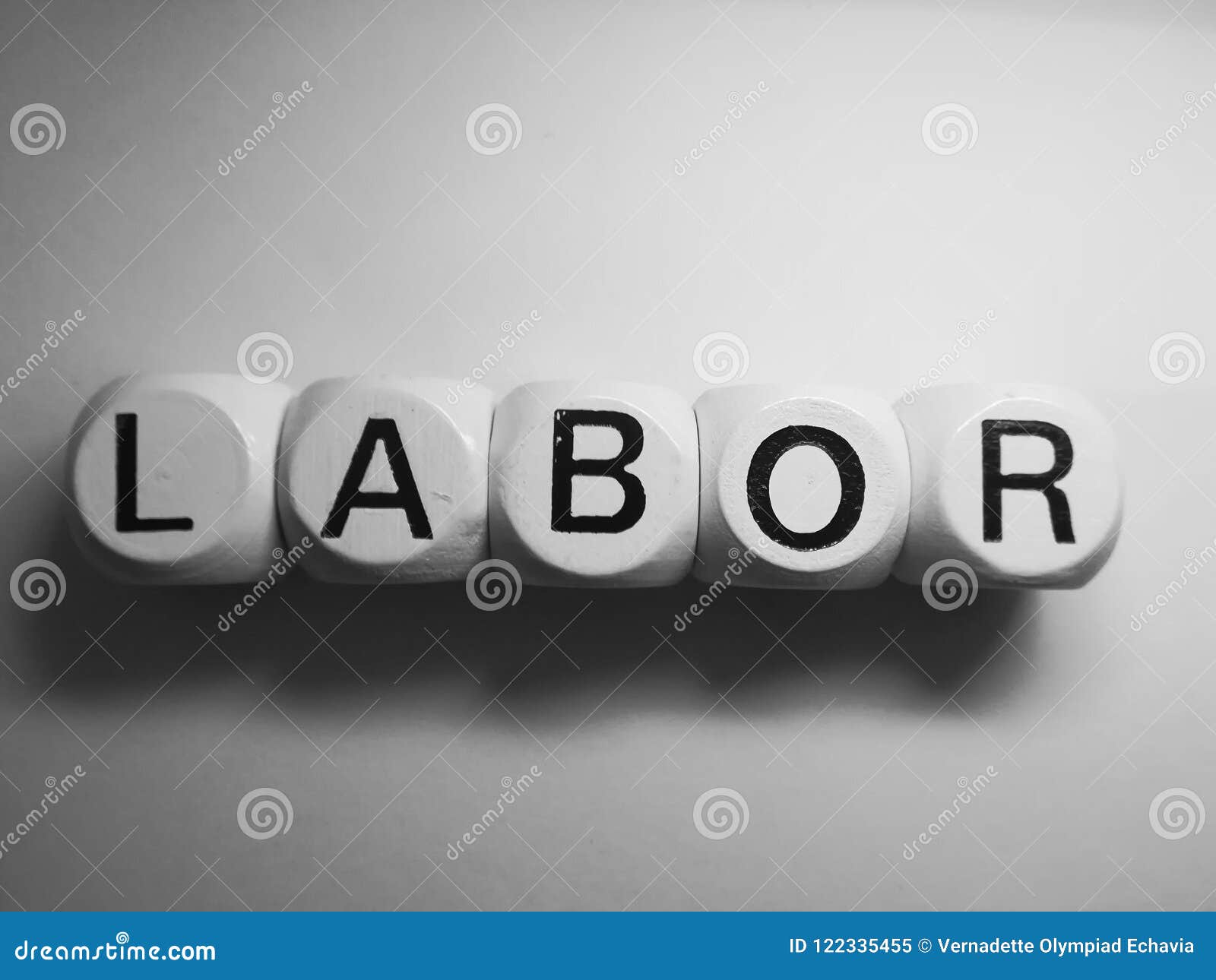 Word labor spelled on dice stock image. Image of shadow - 122335455