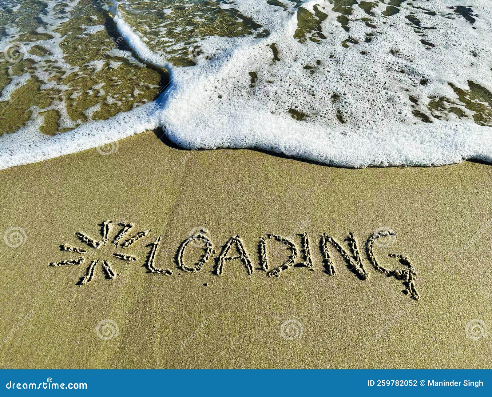 Word loading in the sand stock photo. Image of word - 259782052