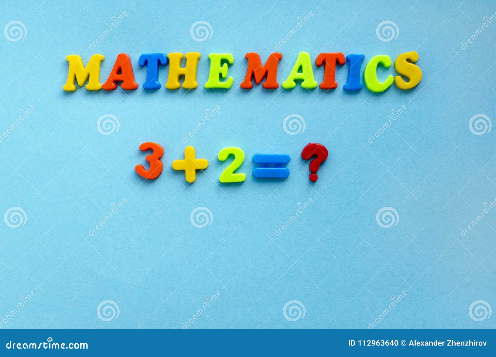 Word `mathematics` of Colored Plastic Magnetic Letters on Blue Paper ...
