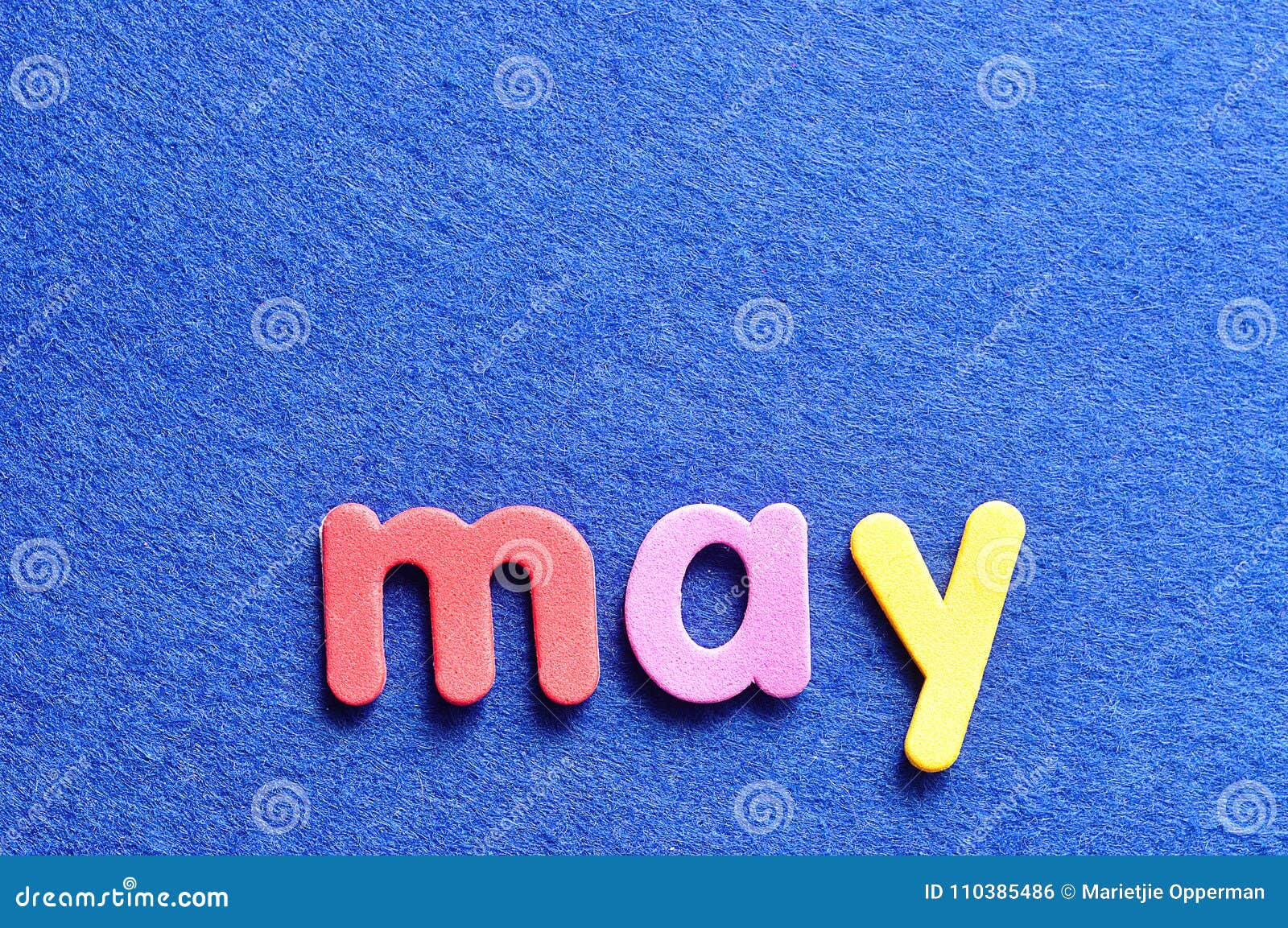 May on a blue background stock photo. Image of blue - 110385486