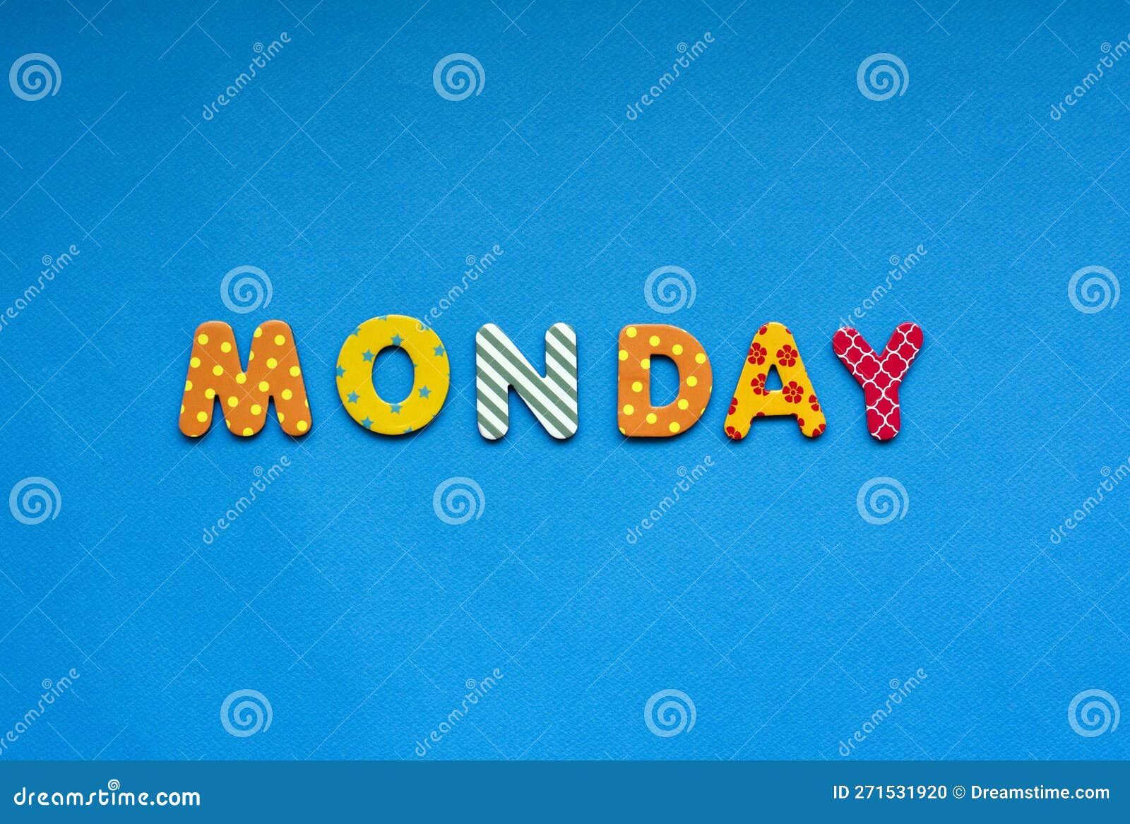 Word Monday from Bright Colored Paper Letters on Blue Paper Background ...