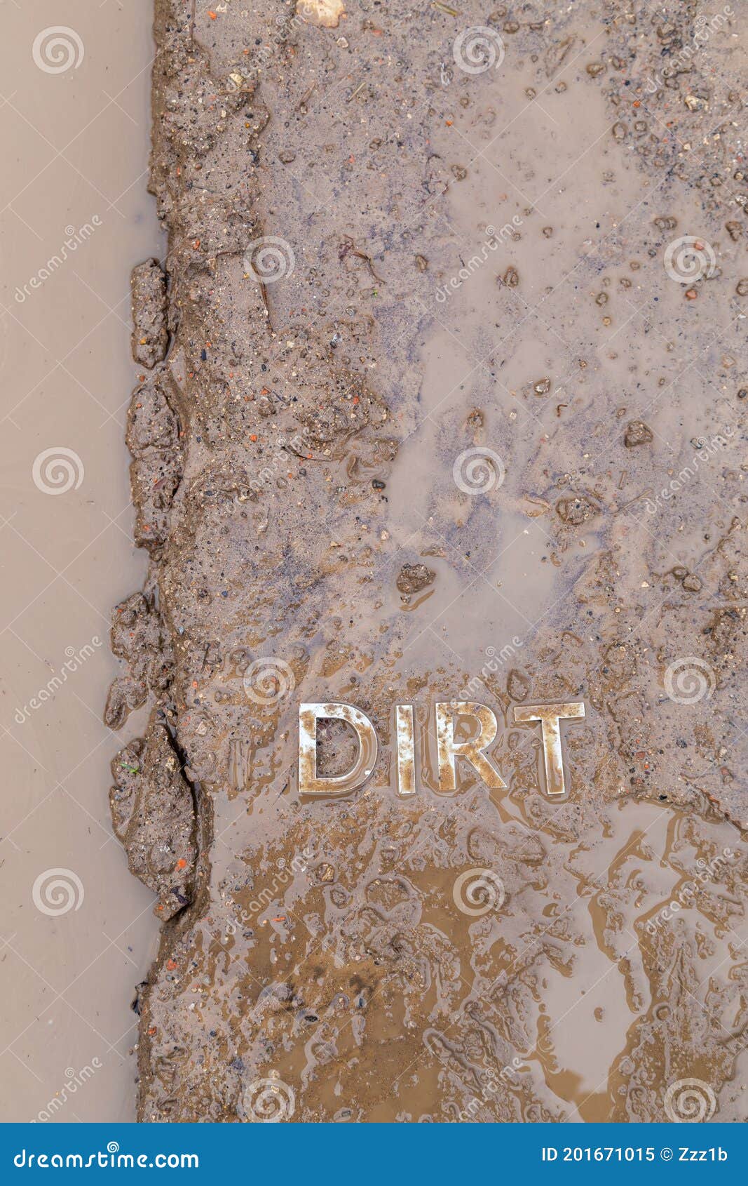 The Word Mud Imprinted in Wet Dirt Road Surface - Close-up with ...