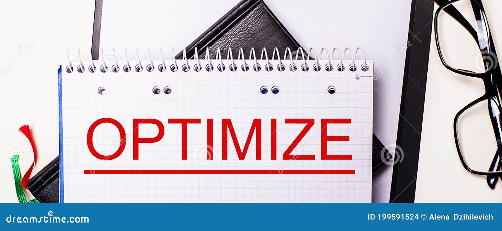 The Word OPTIMIZE is Written in Red in a White Notebook Next To Black ...