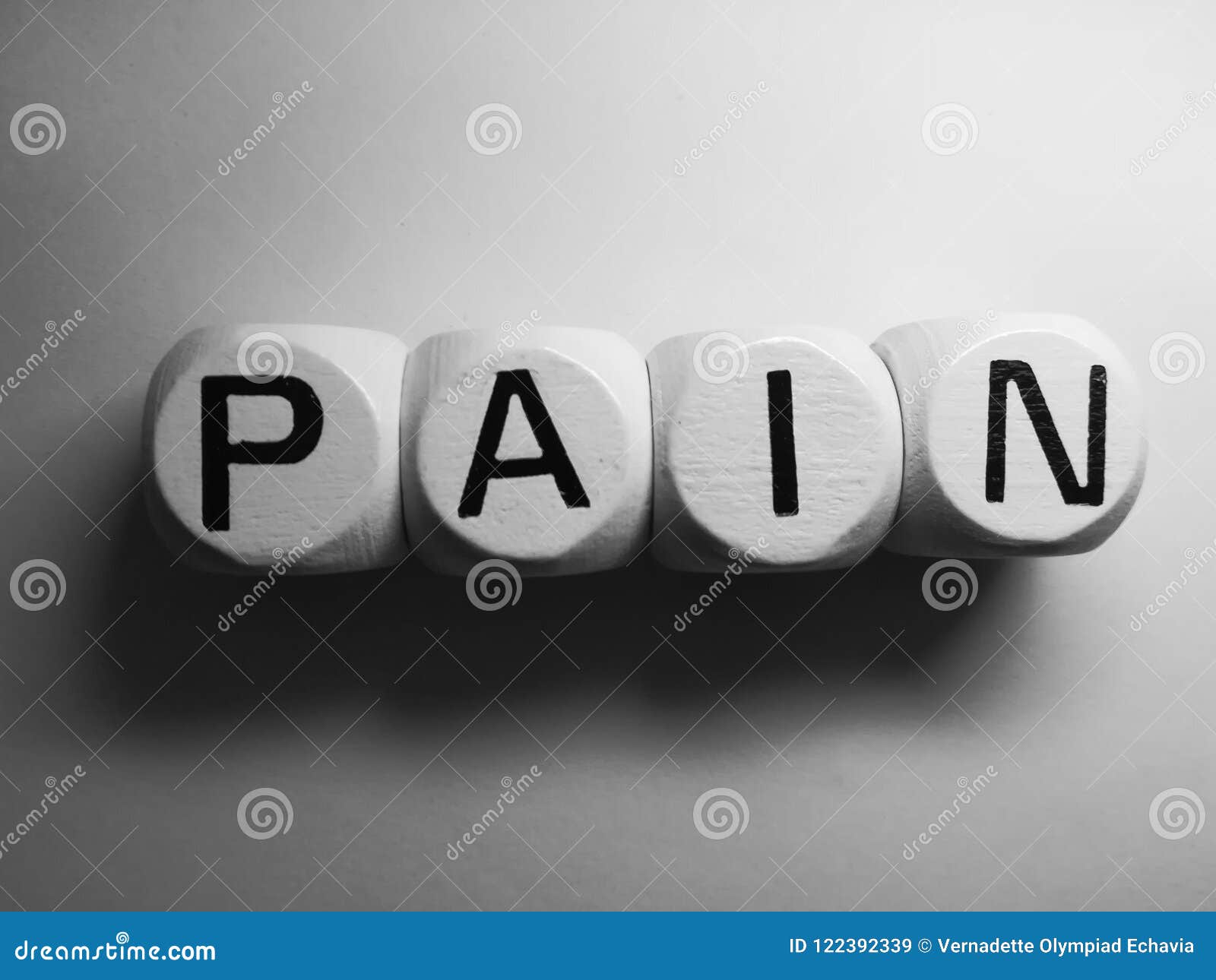 Word pain spelled on dice stock image. Image of word - 122392339