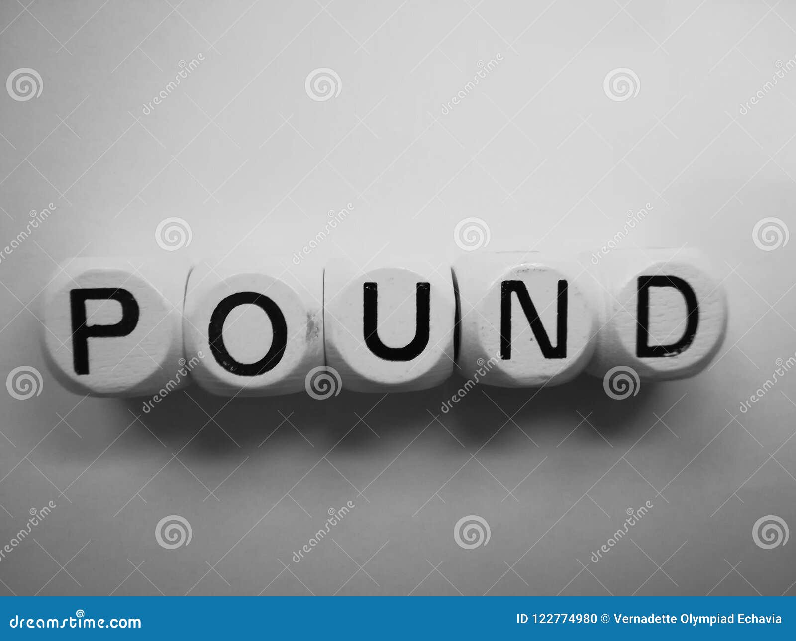 Word pound spelled on dice stock photo. Image of typescript - 122774980