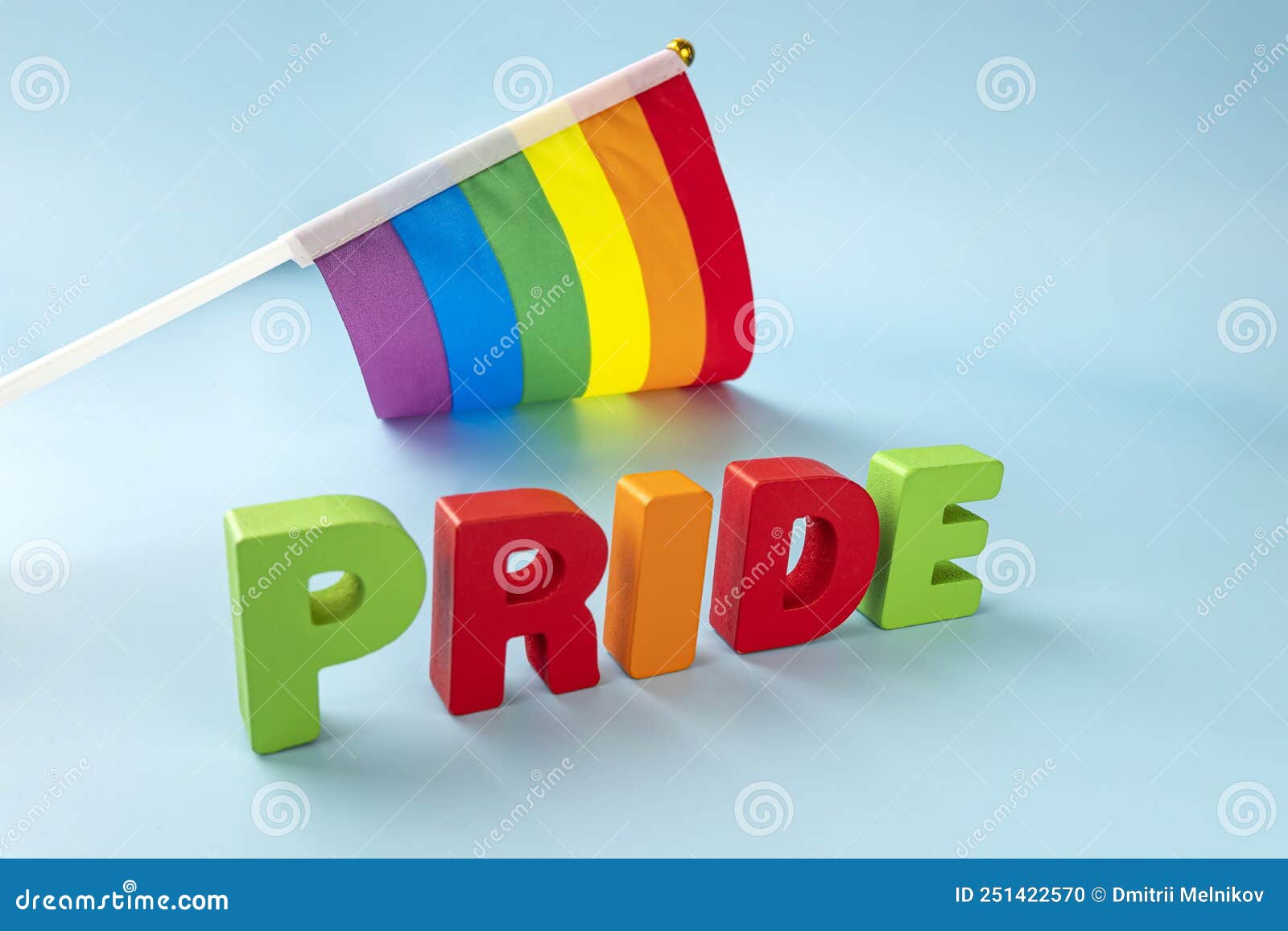 Word PRIDE in Single Letters on a Blue Background Stock Photo - Image ...