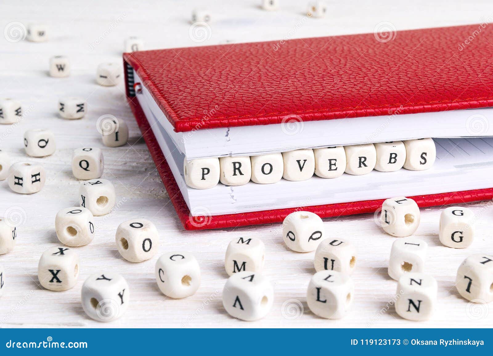 Word Proverbs Written in Wooden Blocks in Red Notebook on White Stock ...