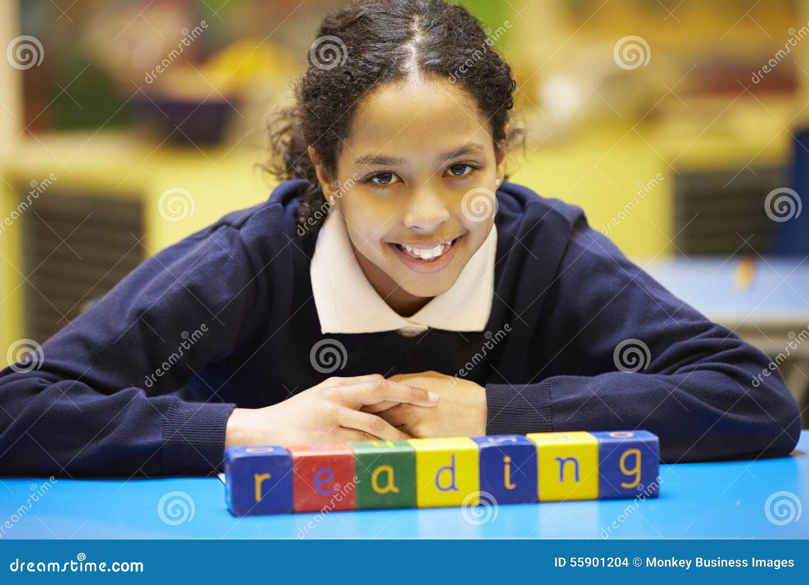 Word Reading Spelt in Wooden Blocks with Pupil Behind Stock Photo ... Word Reading Spelt in Wooden Blocks with Pupil Behind Stock Photo ...