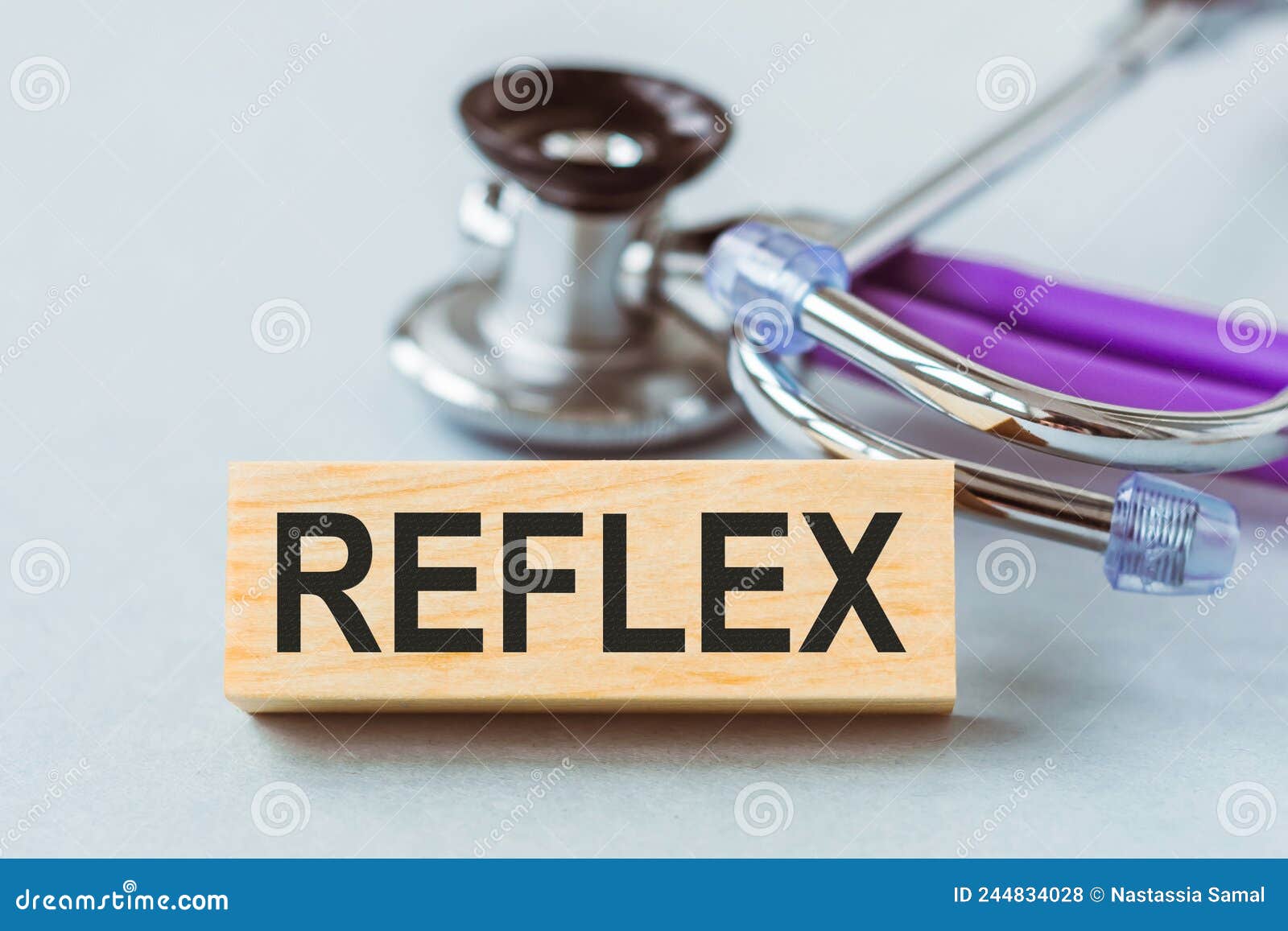 The Word REFLEX Written on Wooden Block Next To a Stethoscope on a ...