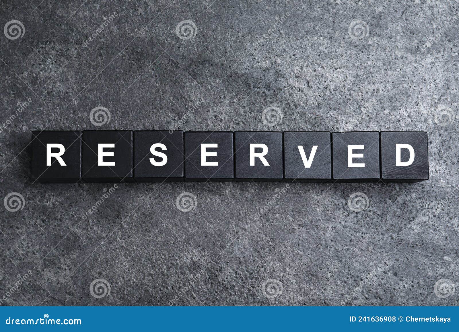 Word RESERVED Made with Cubes on Grey Surface, Top View. Table Setting ...