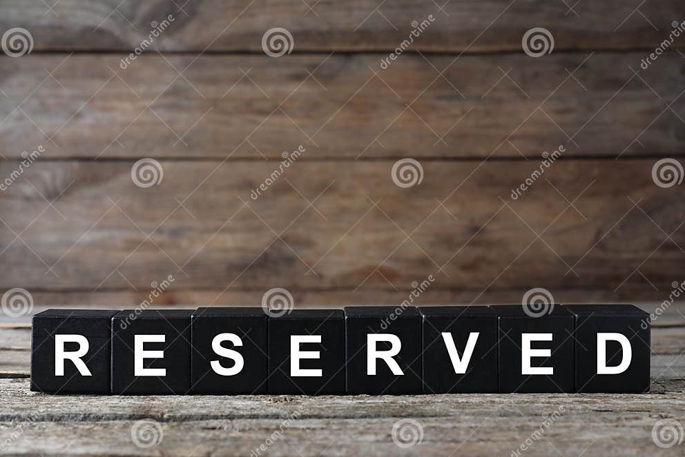 Word RESERVED Made with Cubes on Wooden Surface. Table Setting Element ...