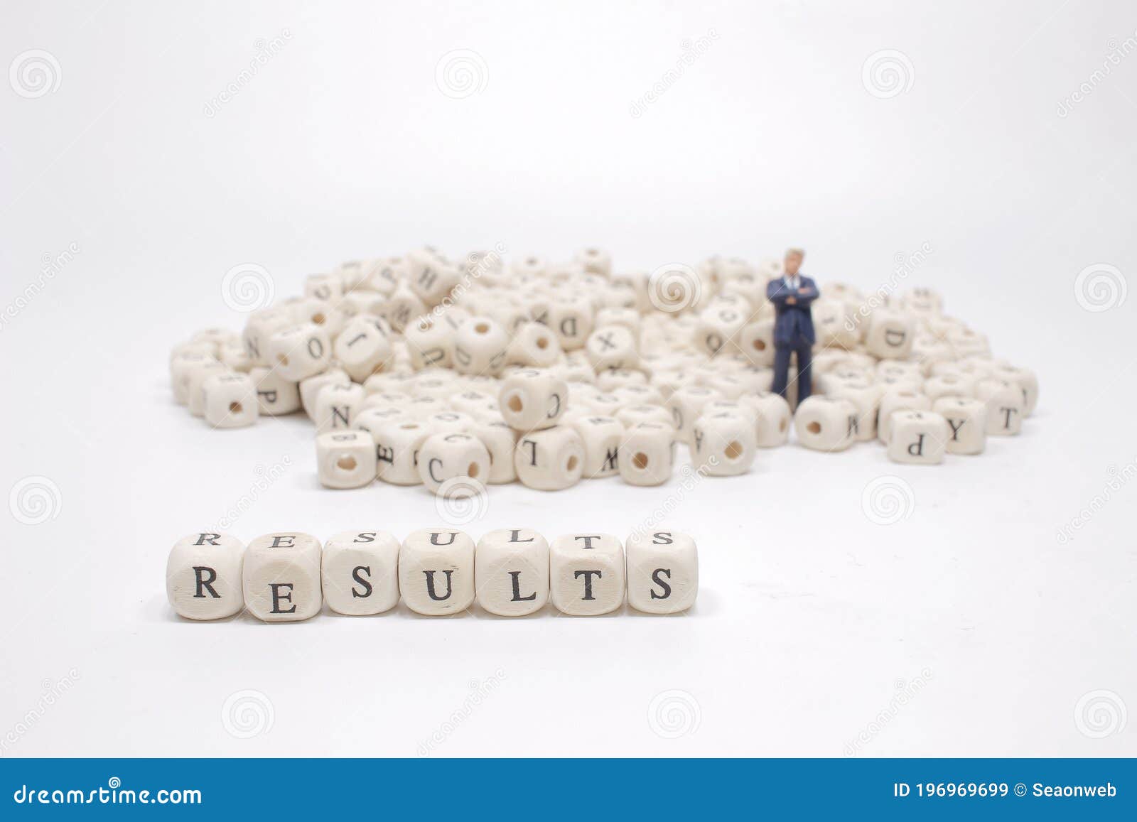 A Word Result on Wooden Cube Block with Figure Stock Image - Image of ...