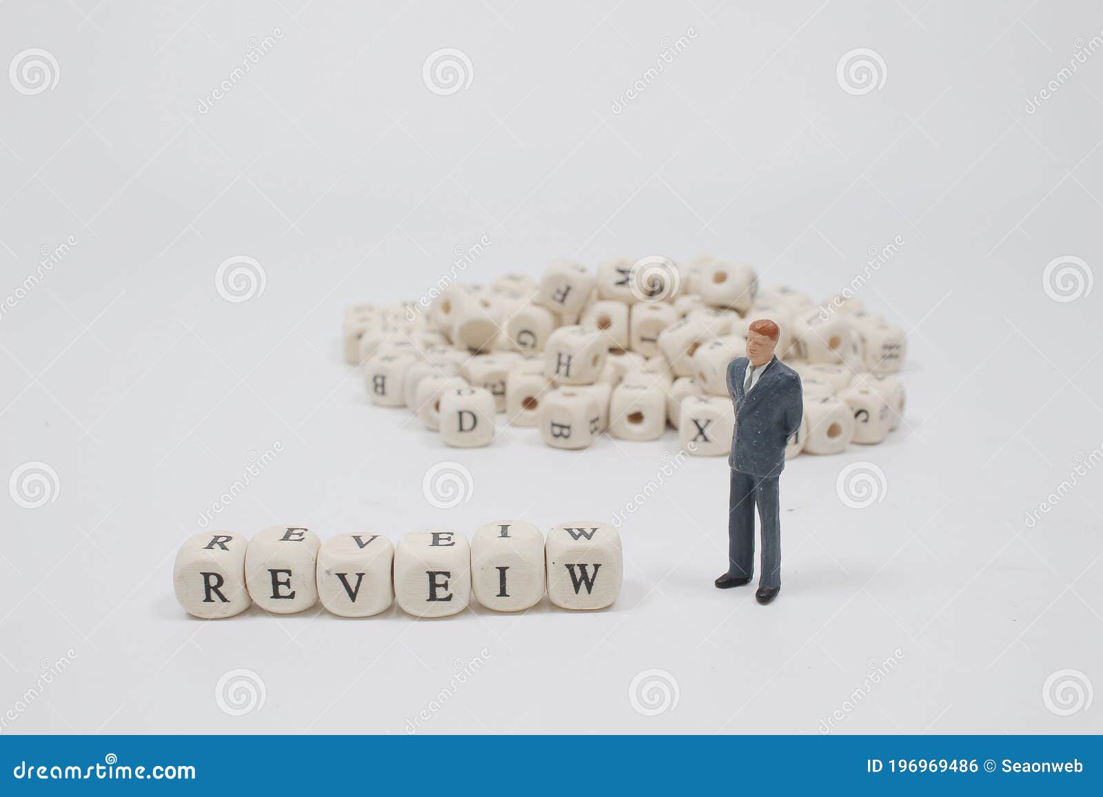 A Word REVIEW on Wooden Cube Block with Figure Stock Photo - Image of ...